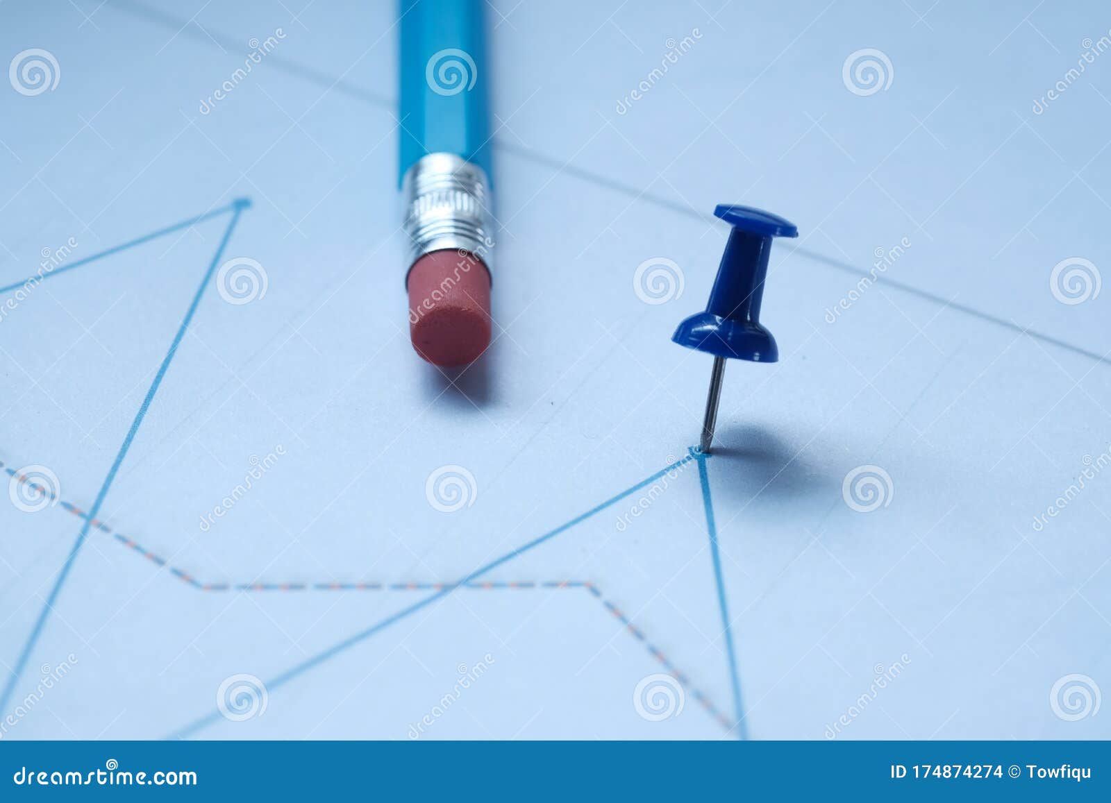 Close Up of Push Pin on Stock Chart with Pencils on Paper Stock Photo ...