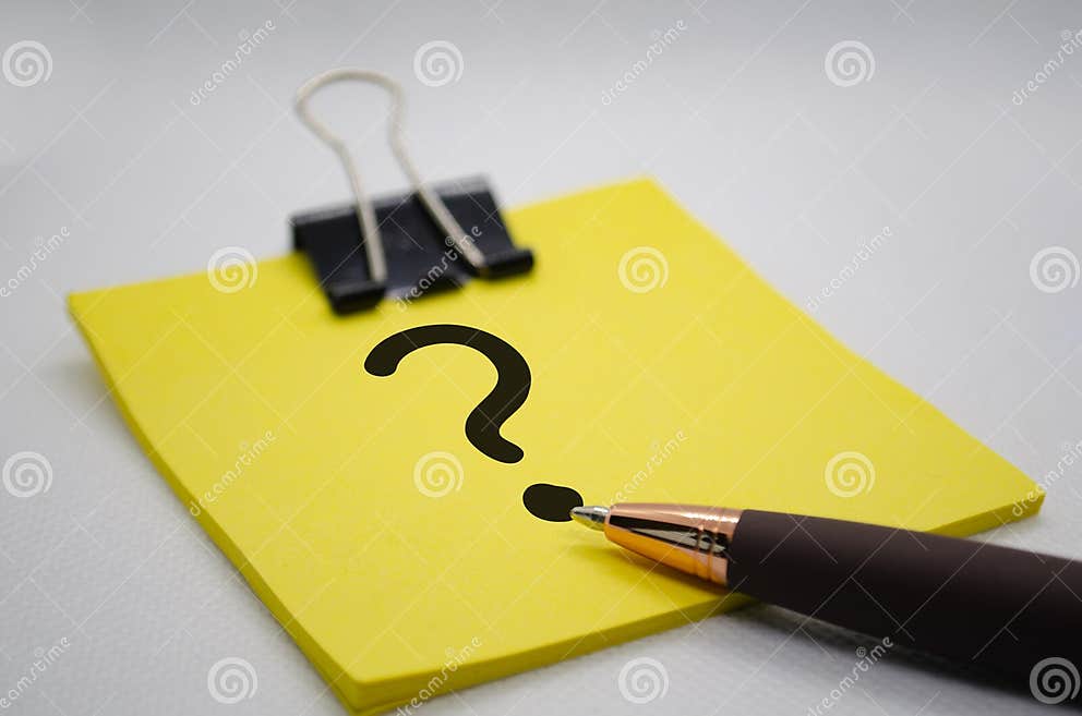 Close Up of Question Mark on Notepad with Pen on White Background ...
