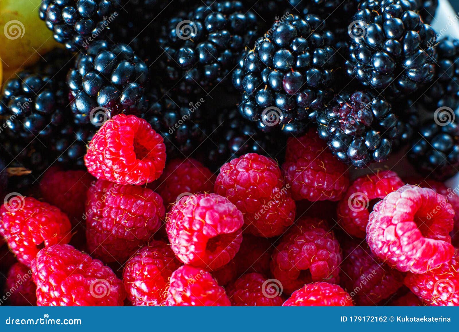 Close-up of Raspberry and Black Mulberry Berries Split Frame. Summer ...