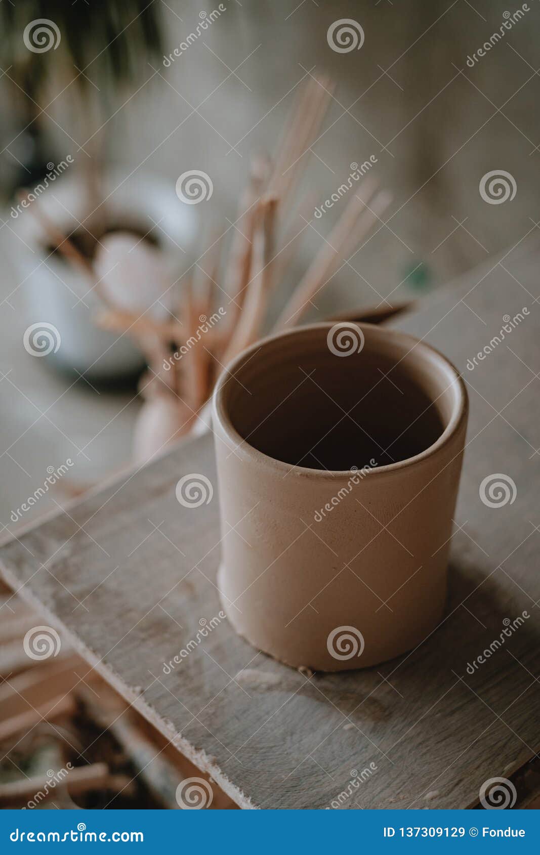 Close-up Raw Ceramic Pottery Cup Drying on Wooden Table, Clay Texture ...