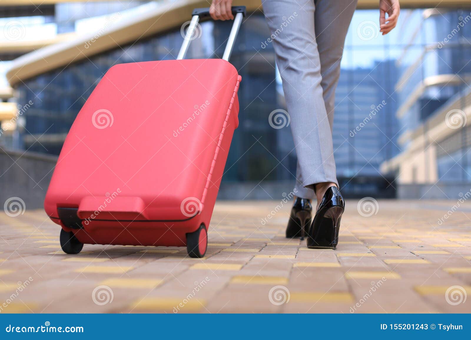 Close Up Rear View of Young Woman Pulling Luggage while Walking ...
