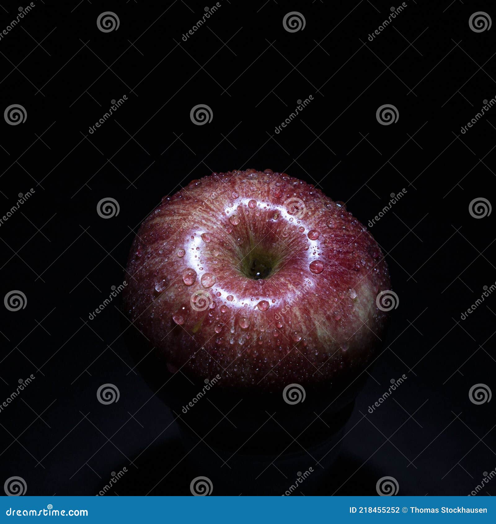 Close-up of a Red Apple, Light from Above, Black Background, Water ...