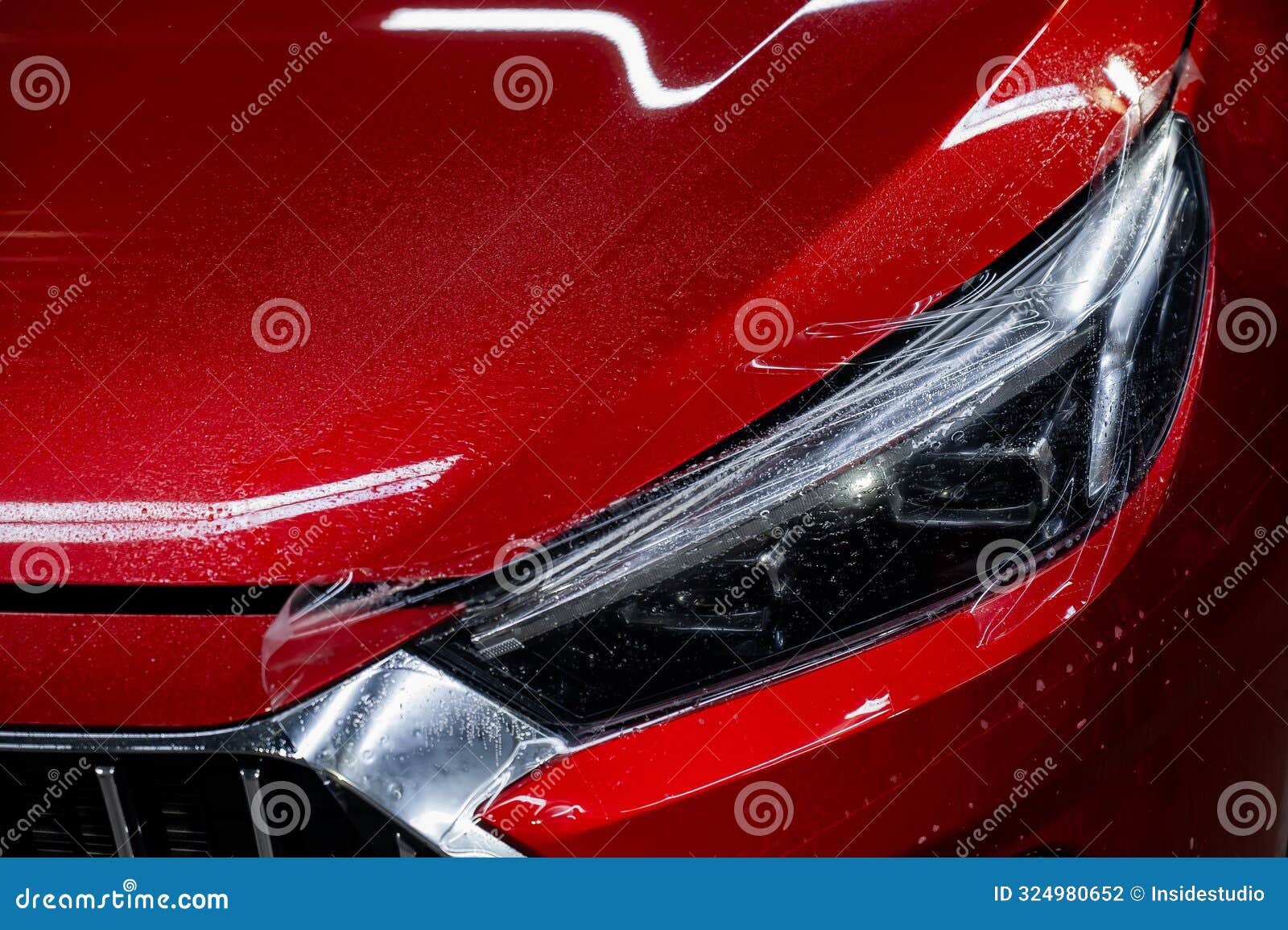 Close-up of a Red Car Headlight with Vinyl Wrap. Stock Photo - Image of ...