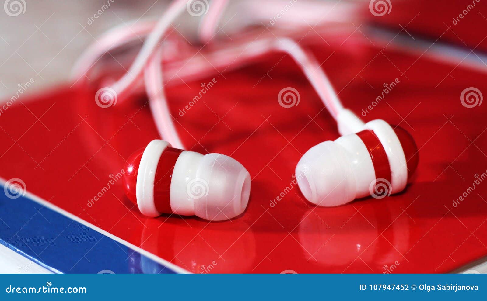 Close Up on Red Earbuds, a Trendy Device for the Player Stock Photo ...