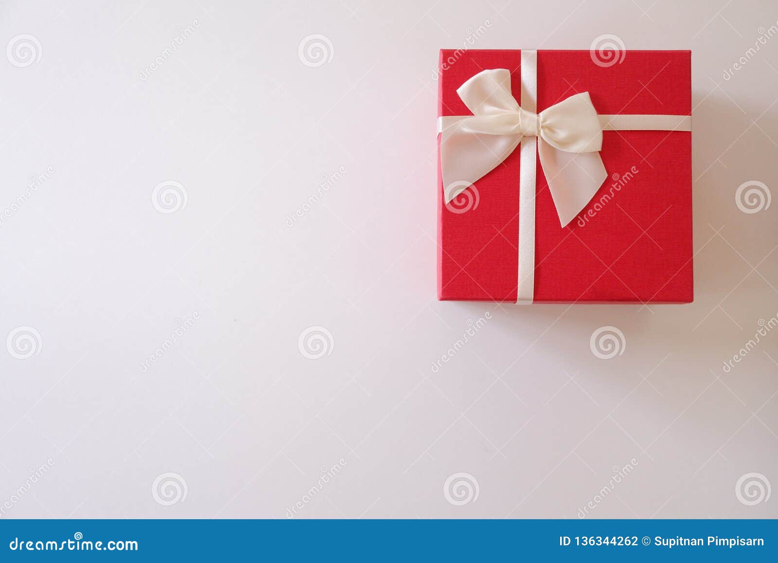 Close-up Red Gift Box with White Ribbon on White Background. Stock ...