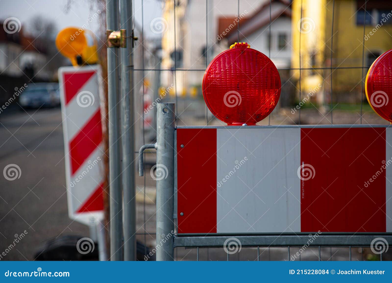 Close-up of Red Warning Lights with Street Barriers at a Construction ...