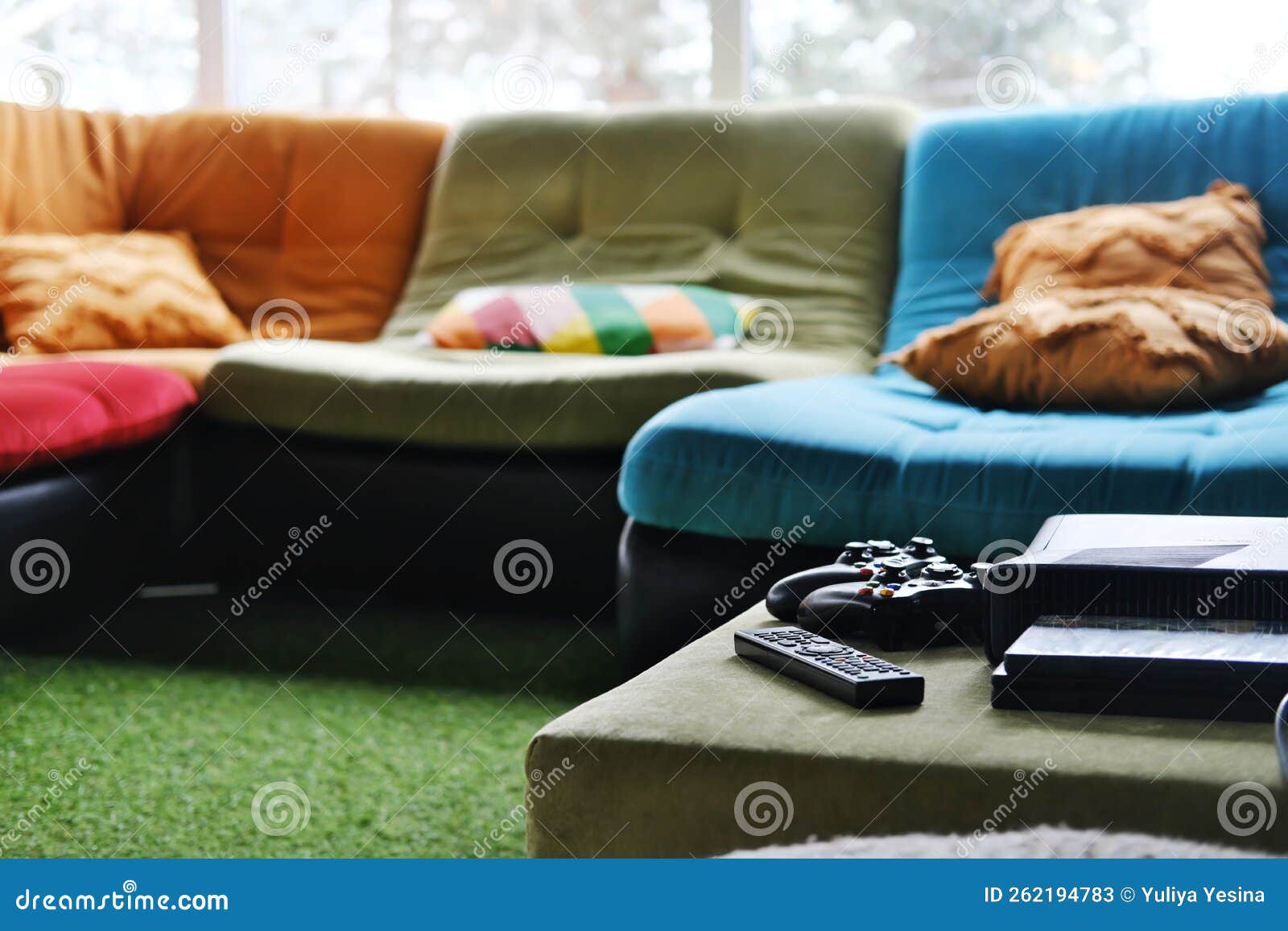 Close-up of Remote Control, Game Console and Disc Packaging on Table in ...
