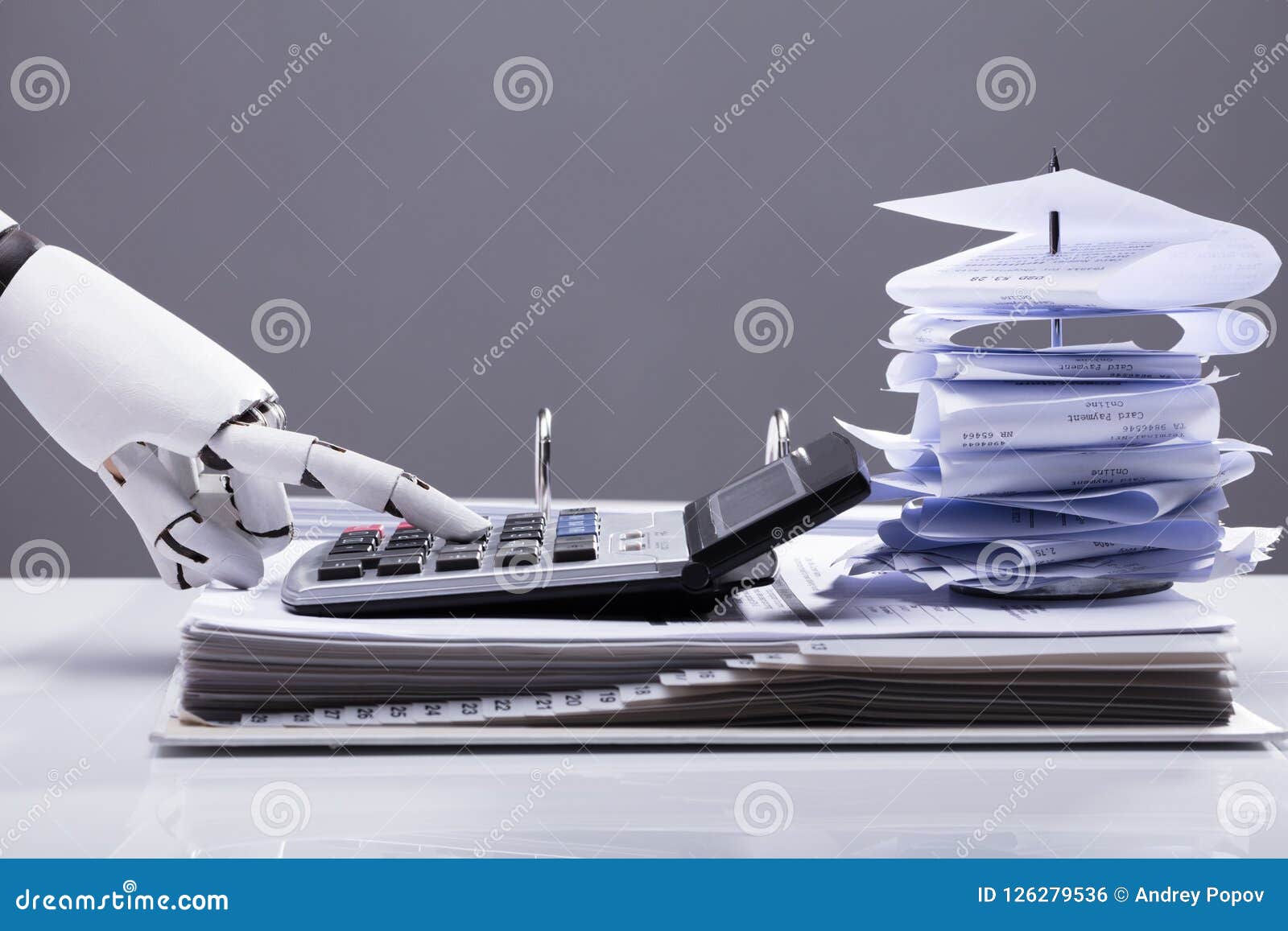 Robotic Hand Using Calculator in Office Stock Photo - Image of finance ...
