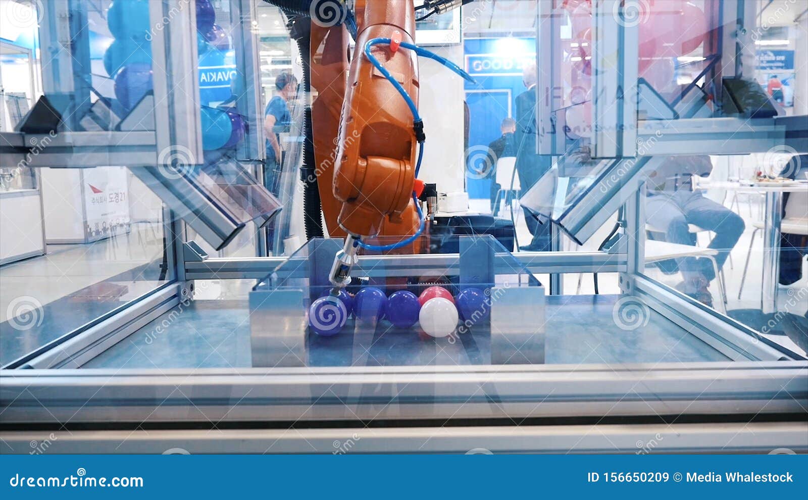 Close-up Of Robotic Machine Hand Relocating Small Plastic Multicolored ...