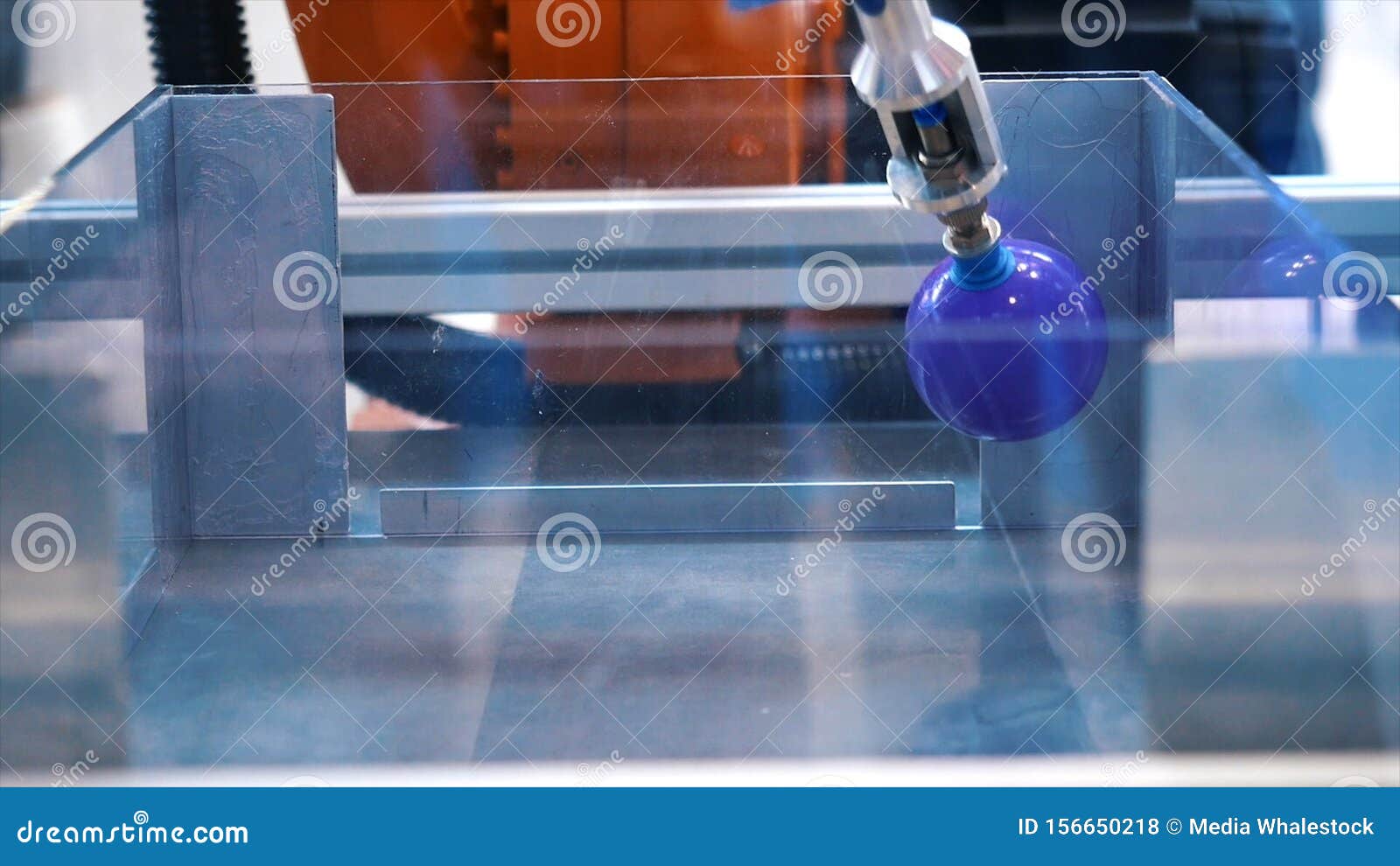 Close-up of Robotic Machine Hand Relocating Small Plastic Multicolored ...