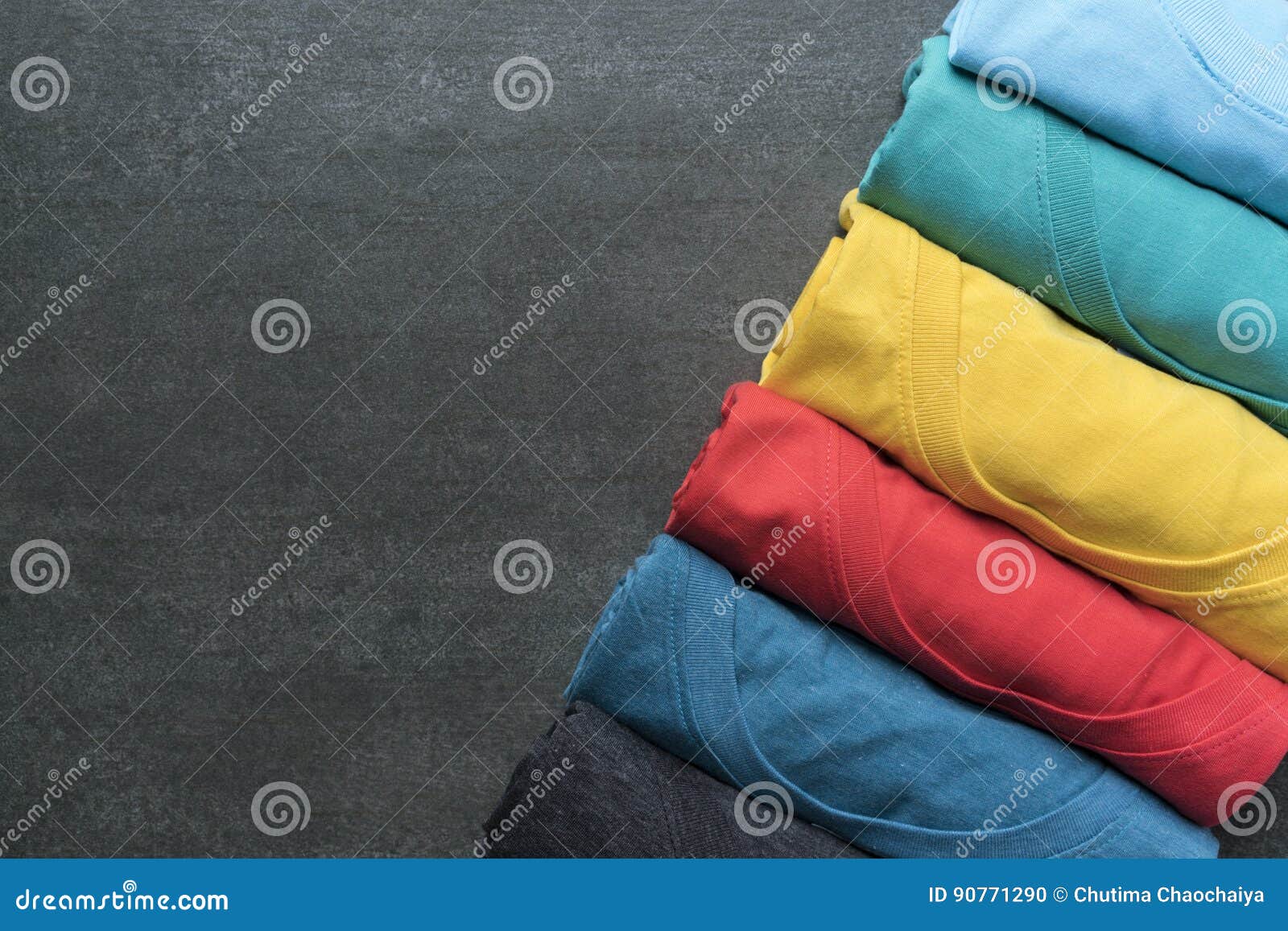 Close Up of Rolled Colorful Clothes on Black Background Stock Photo ...