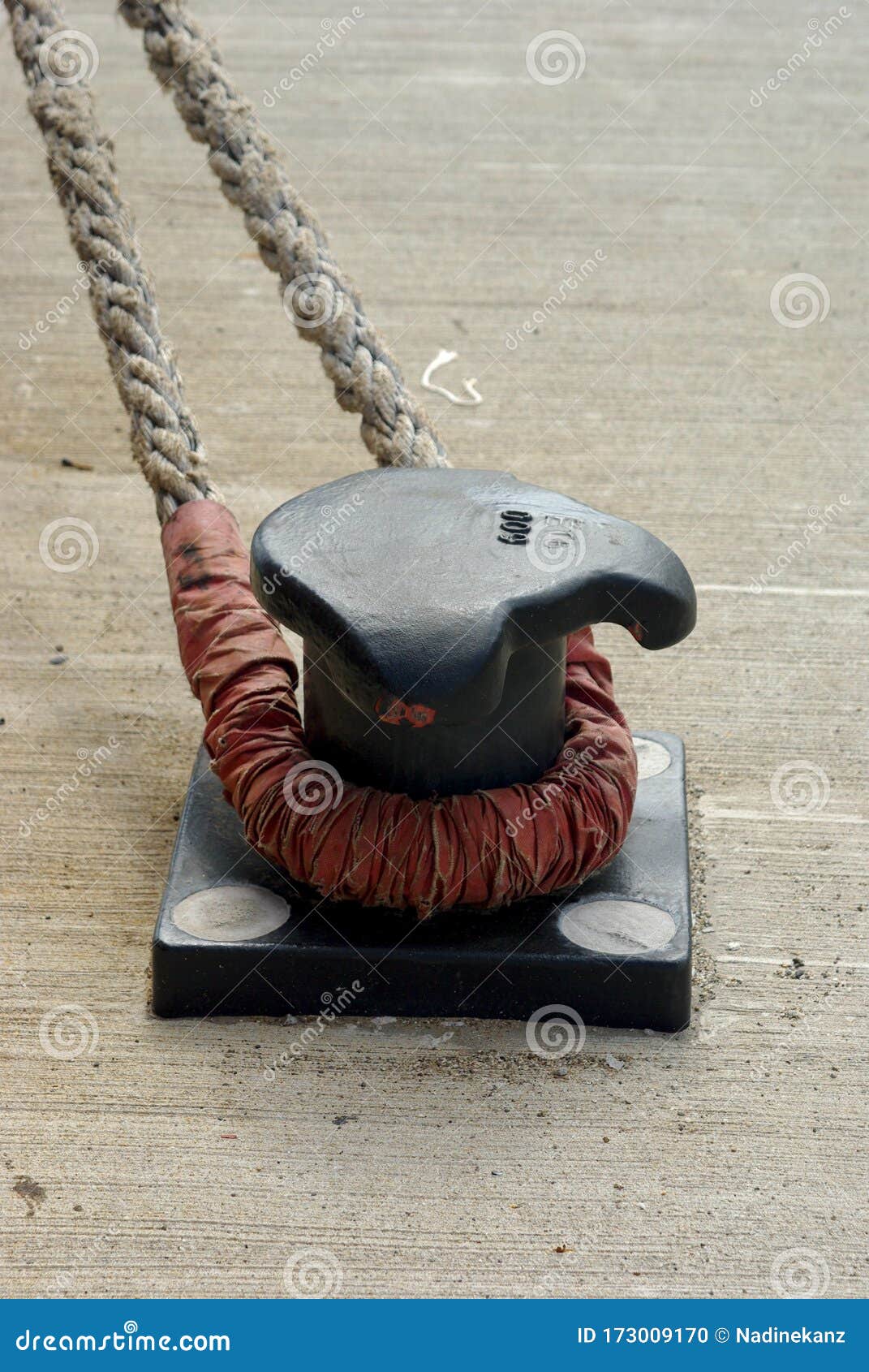 A Close-up of a Rope Tied Around a Pole in the Harbour Stock Photo ...
