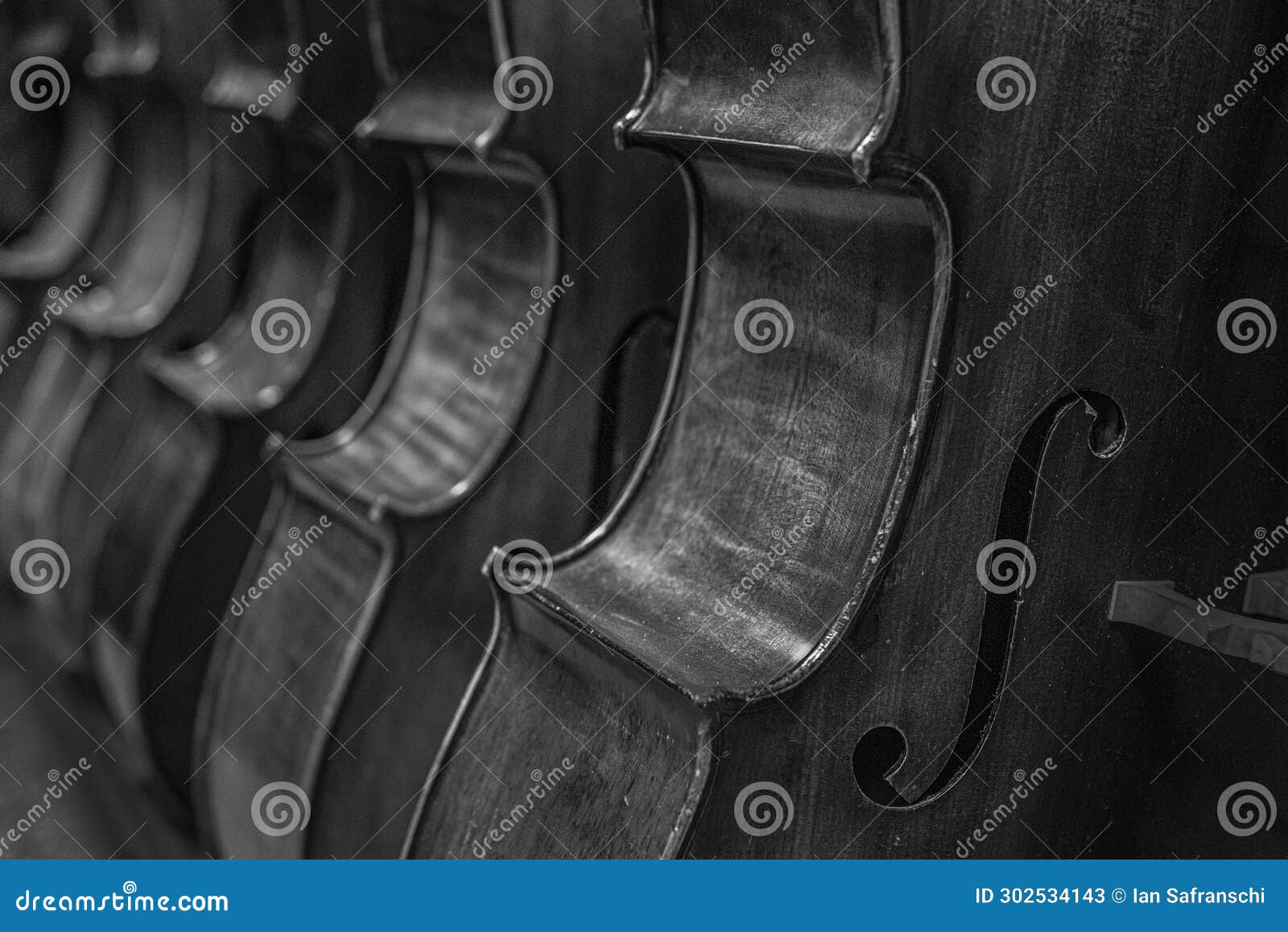 Close Up of a Row of Multiple Cellos Standing on the Floor at a ...