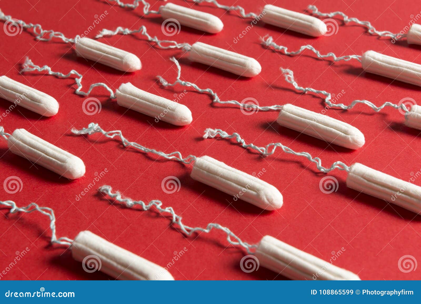 Close Up of Rows of Tampons on a Red Background Stock Image - Image of ...