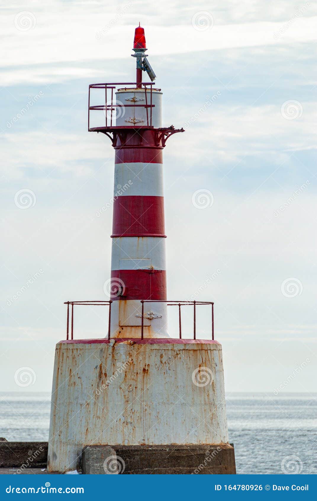 Close Up of a Rusty Old Red and White Striped Harbor Lighthouse at the ...