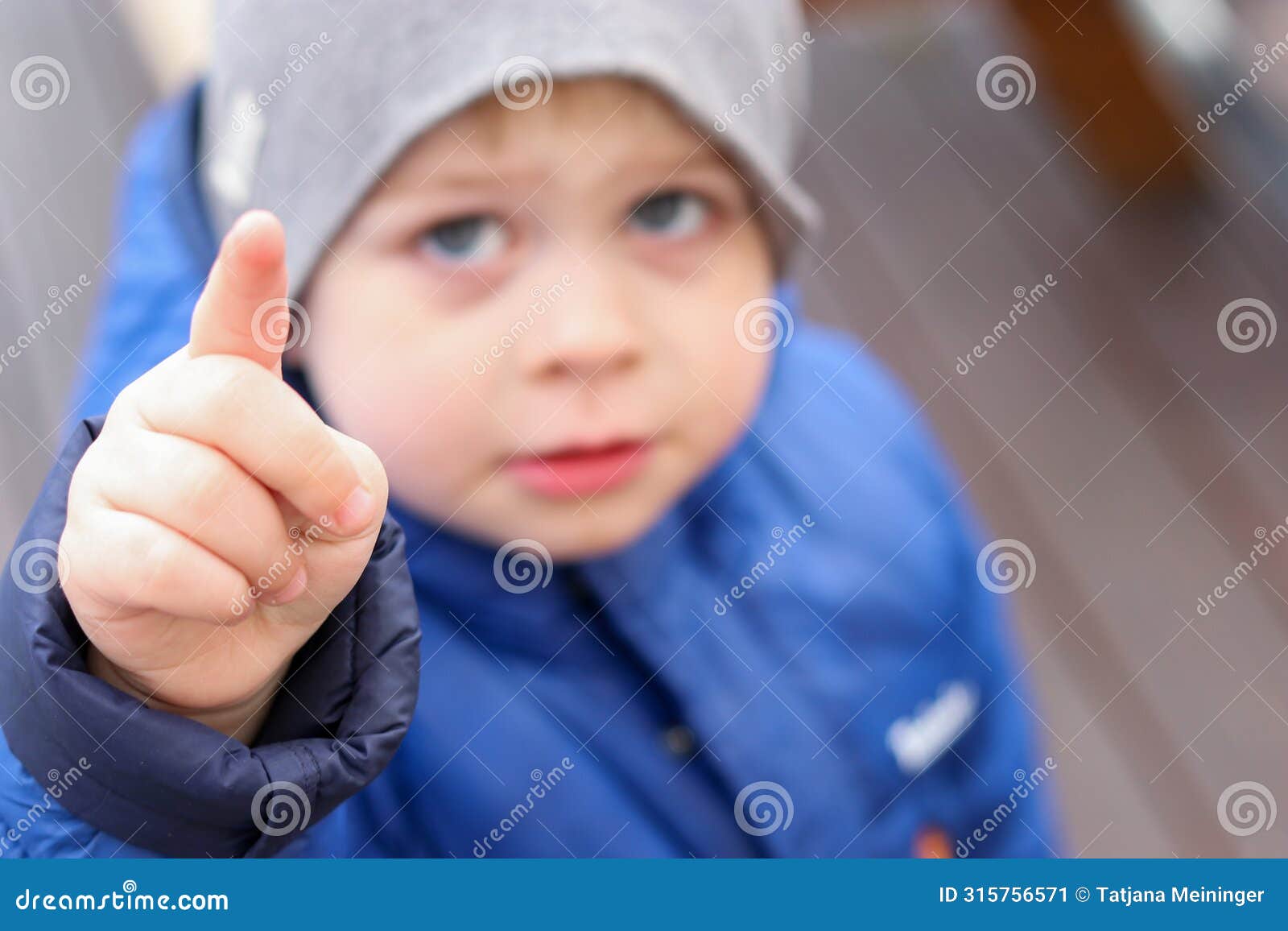 Close Up of a Sad Little Boy Pointing with a Finger Stock Image - Image ...