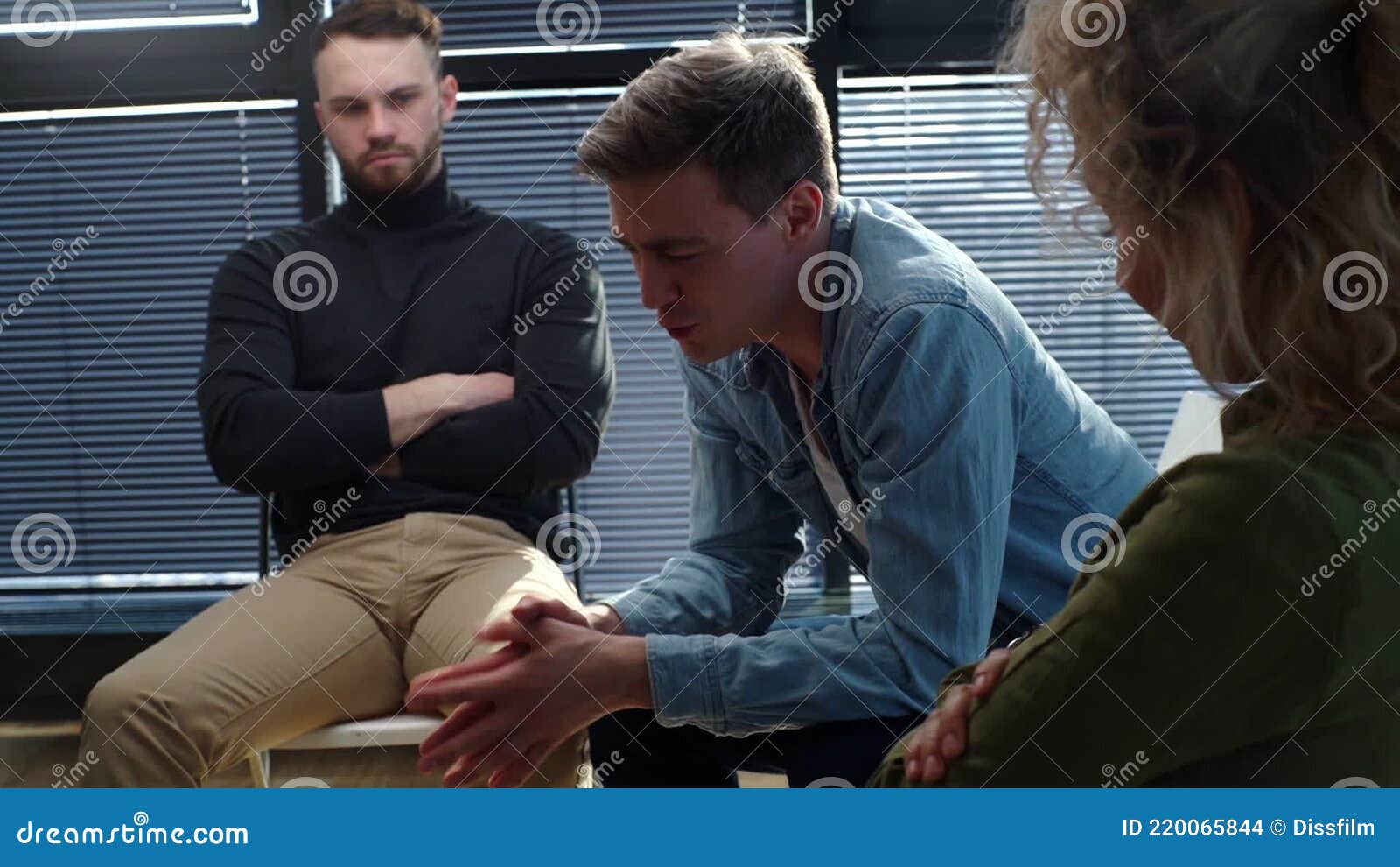 Close-up of Sad Smiling Young Man Sharing Problem Sitting in Circle ...
