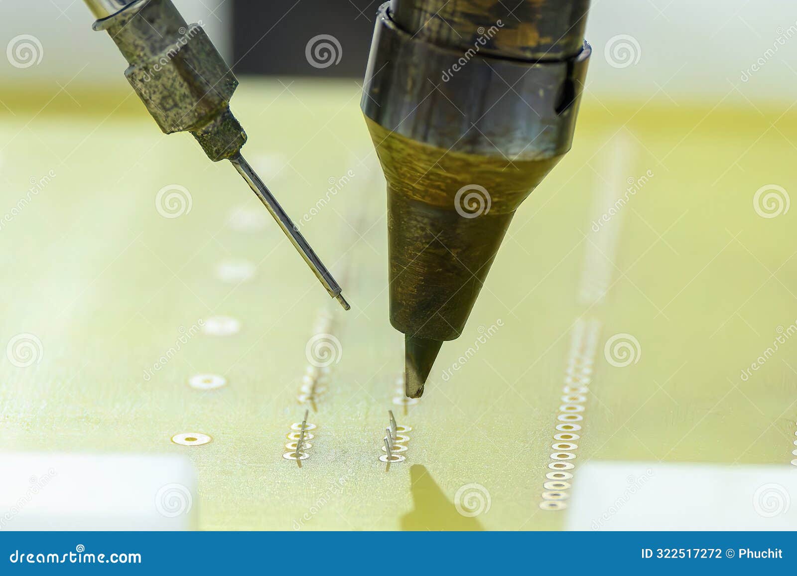 Close Up Scene the Automatic Soldering Machine Operation with PCB Board ...