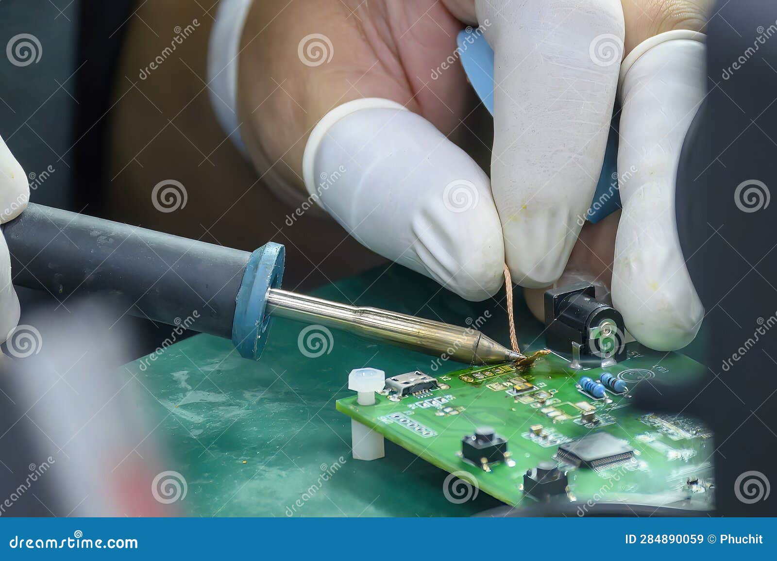 Close Up Scene the Soldering Operation by Skill Operator with Rubber ...