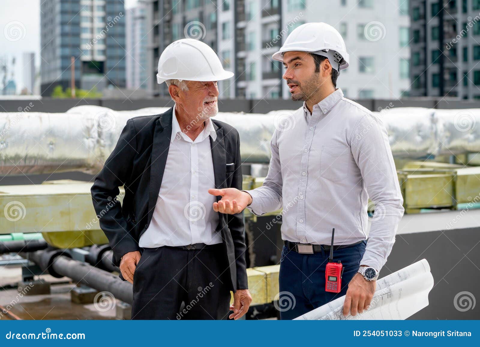 Close Up Scene with Two Engineers or Technicians Talk Together and Stay ...