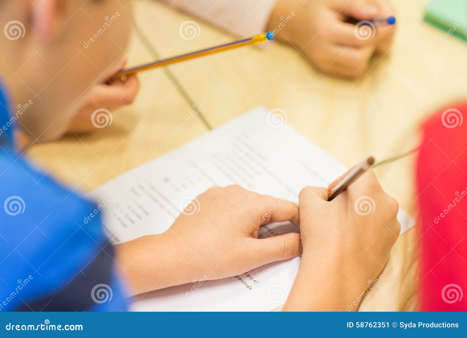 Close Up of Schoolboy Writing Test at School Stock Image - Image of ...