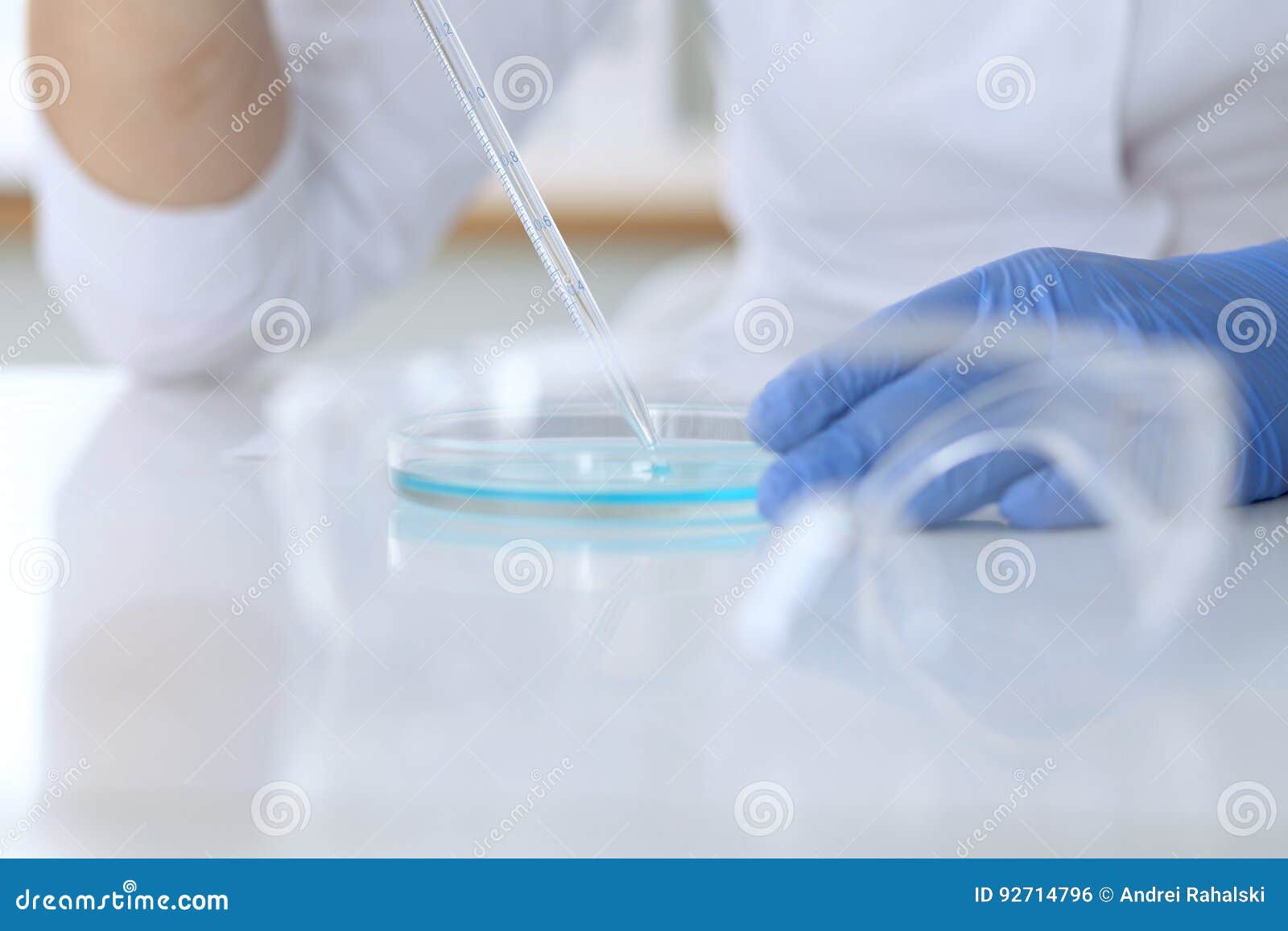 Close Up of Scientific Research Hands with Clear Solution in Laboratory ...