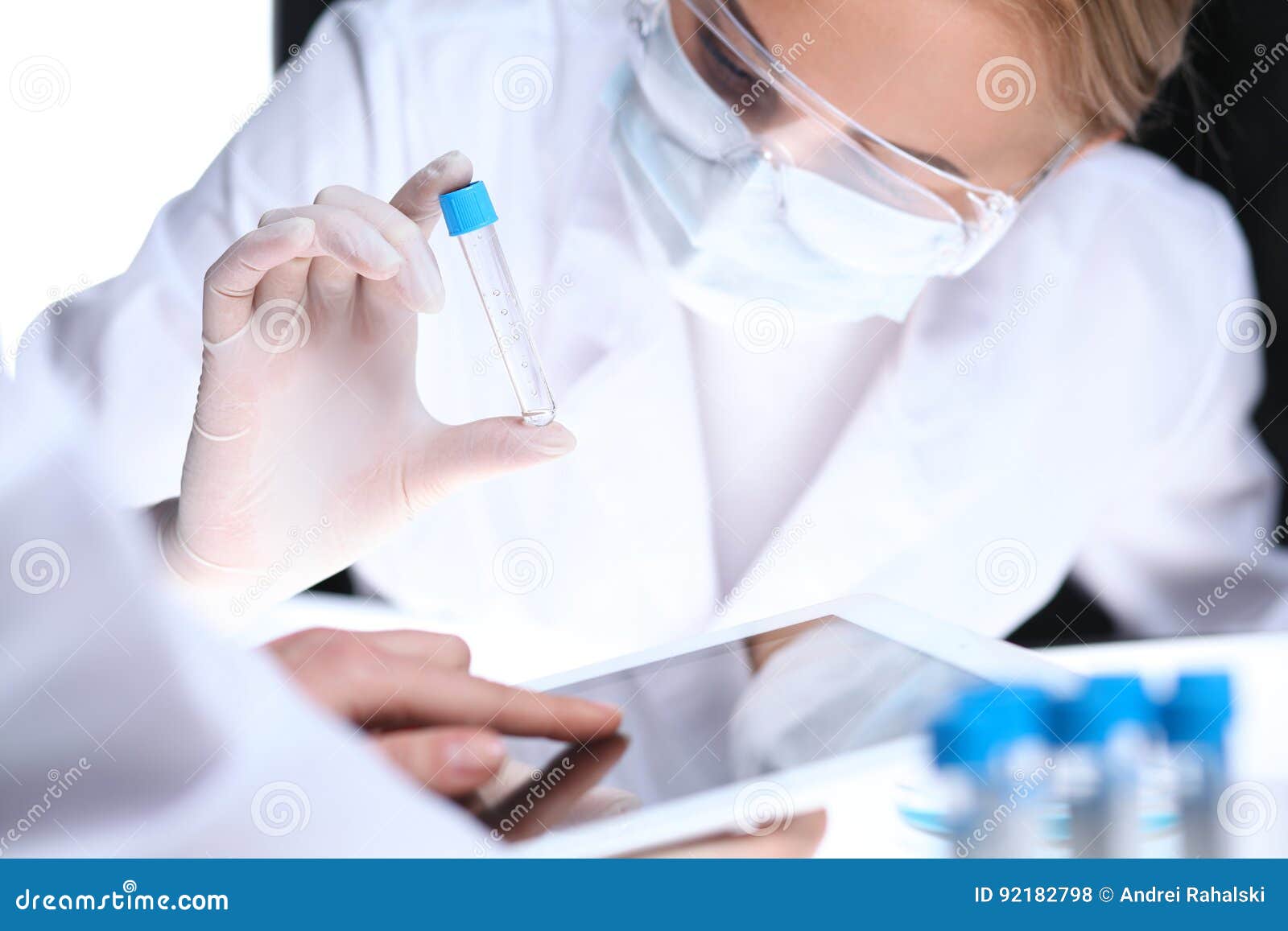 Close Up of Scientific Research Team with Clear Solution in Laboratory ...