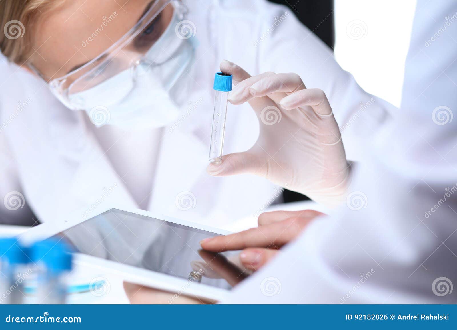 Close Up of Scientific Research Team with Clear Solution in Laboratory ...