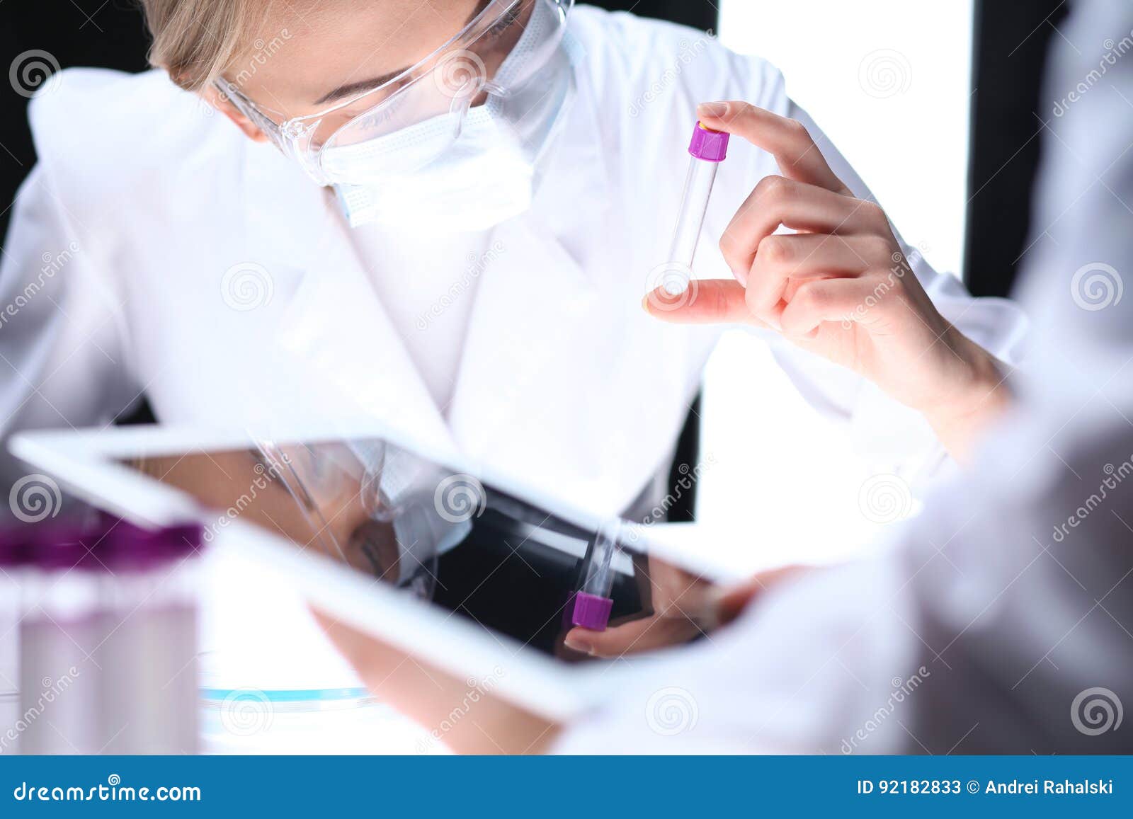 Close Up of Scientific Research Team with Clear Solution in Laboratory ...