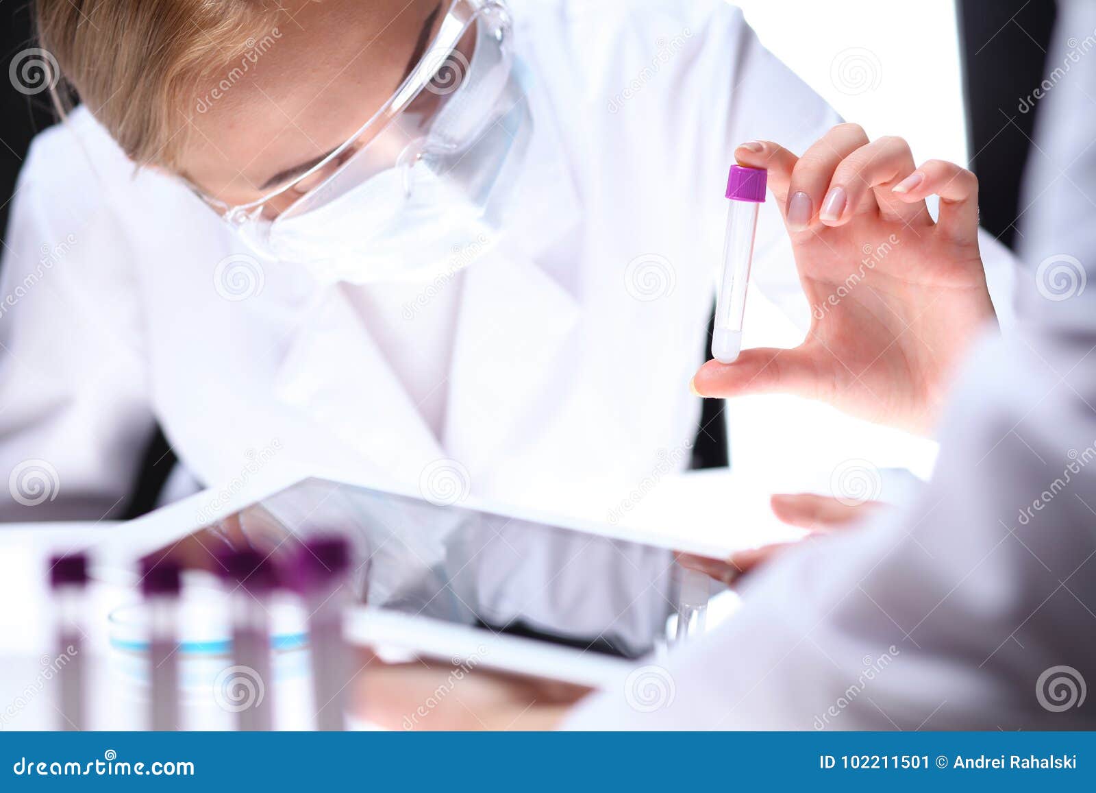 Close-up of Scientific Research Team with Clear Solution in Laboratory ...