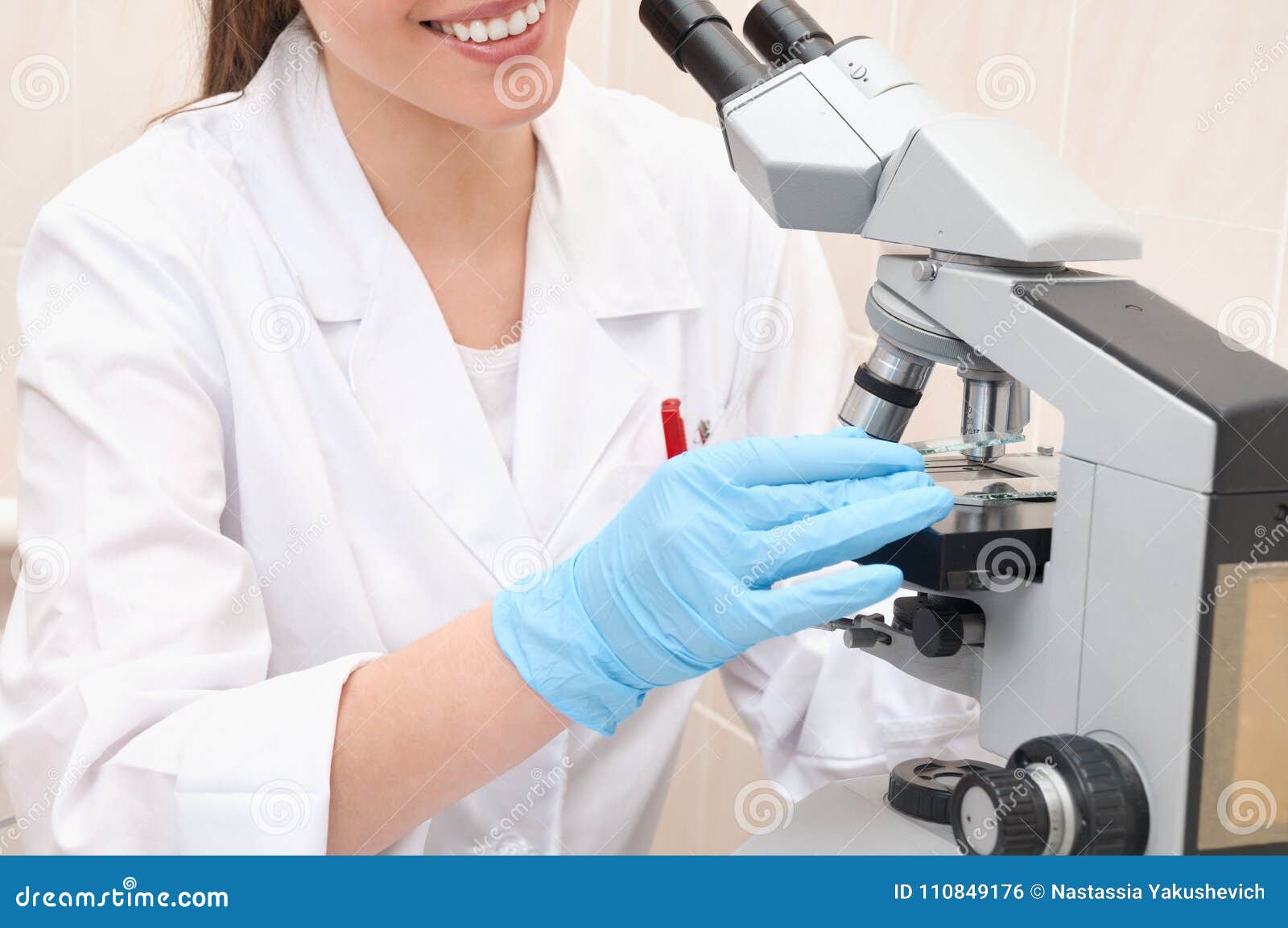Close Up of a Scientist Looking into a Microscope in a Laboratory Stock ...