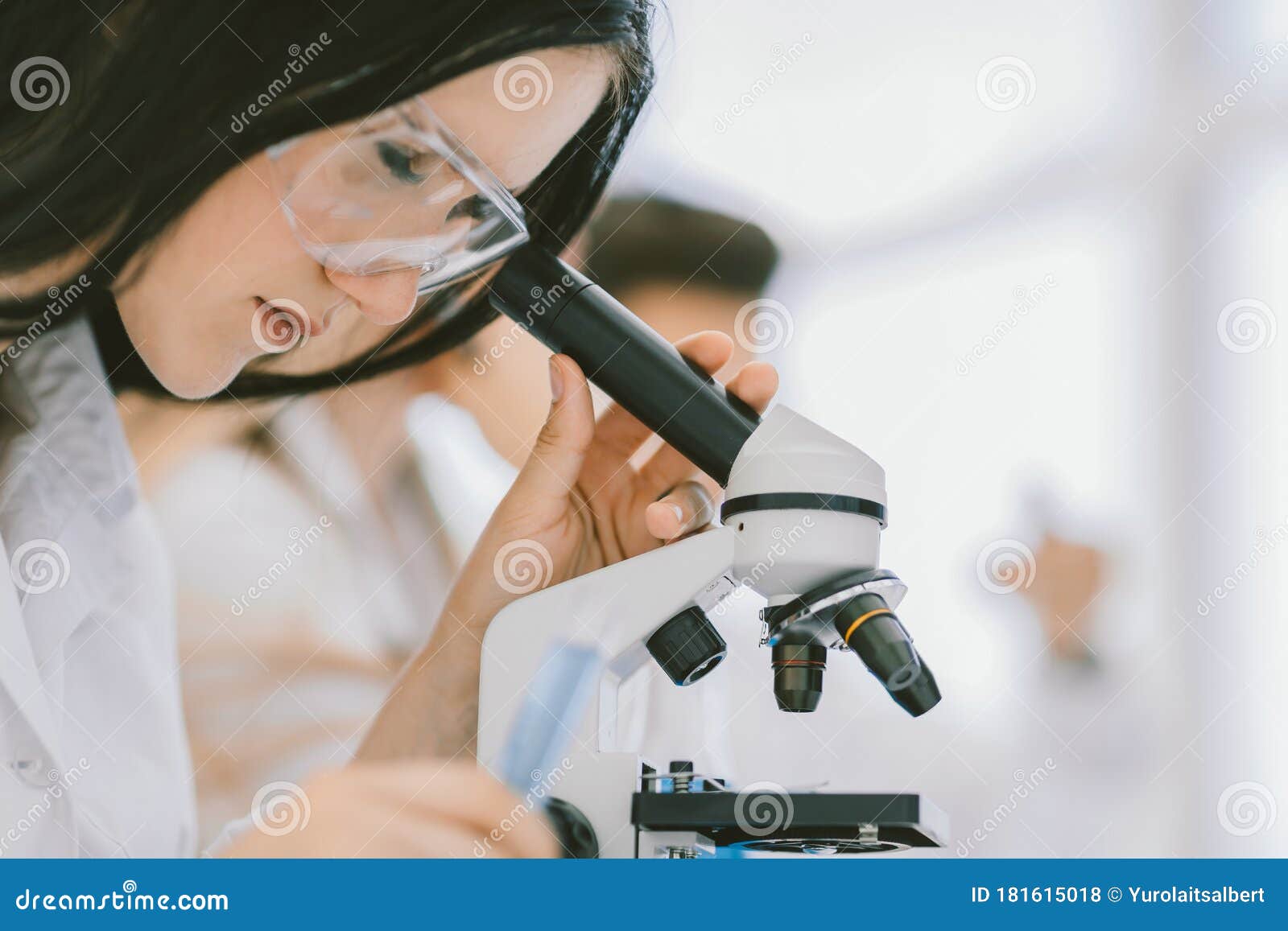 Close Up.the Scientist Looks into the Microscope in the Laborat Stock ...