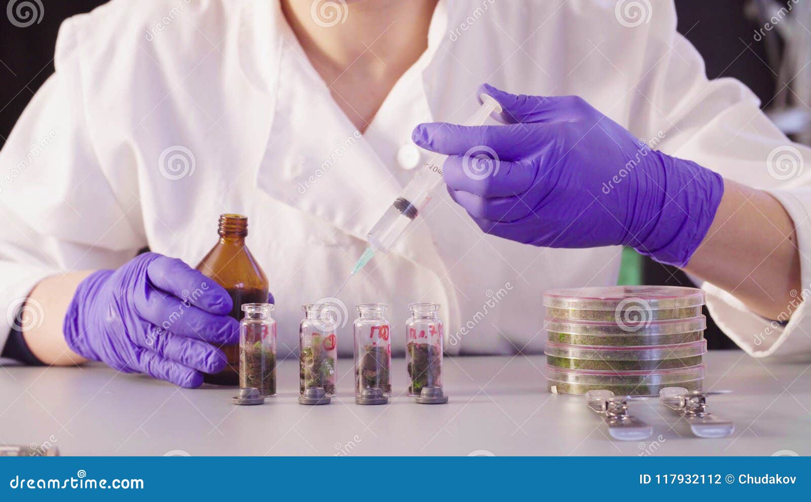 The Scientist`s Hands Pouring Solvent into the Bottles Stock Photo ...