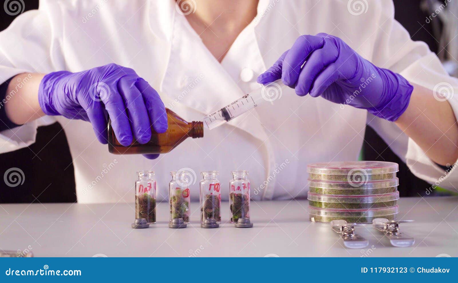 The Scientist`s Hands Pouring Solvent into the Bottles Stock Image ...