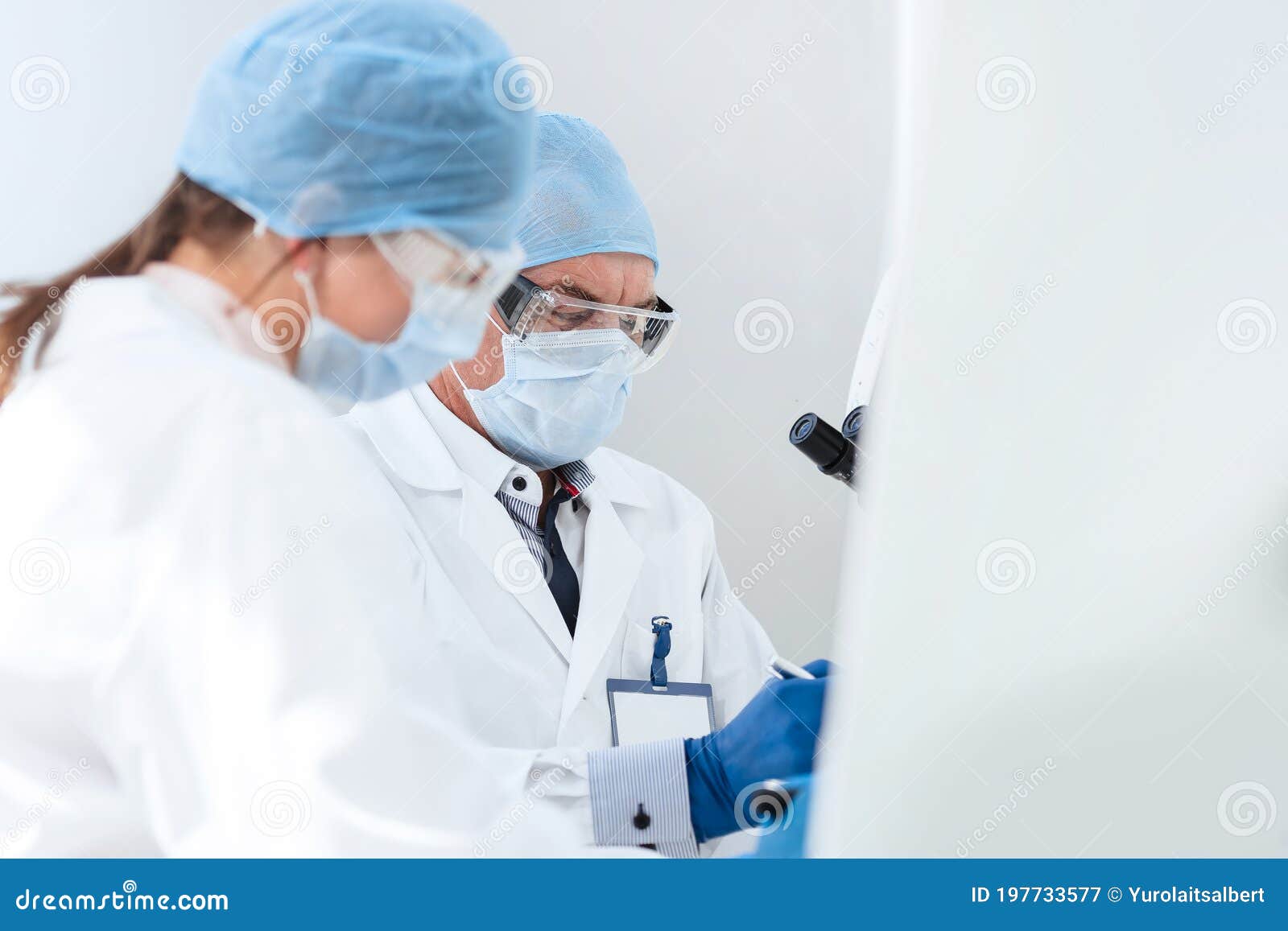 Close Up. Scientists in Protective Masks Work in the Laboratory Stock ...