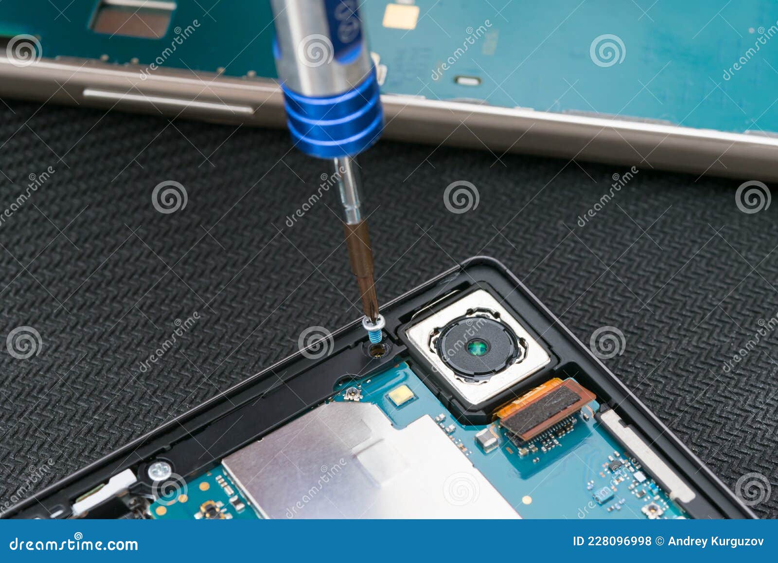 Close-up of a Screwdriver Unscrewing a from a Mobile Phone Case Stock ...