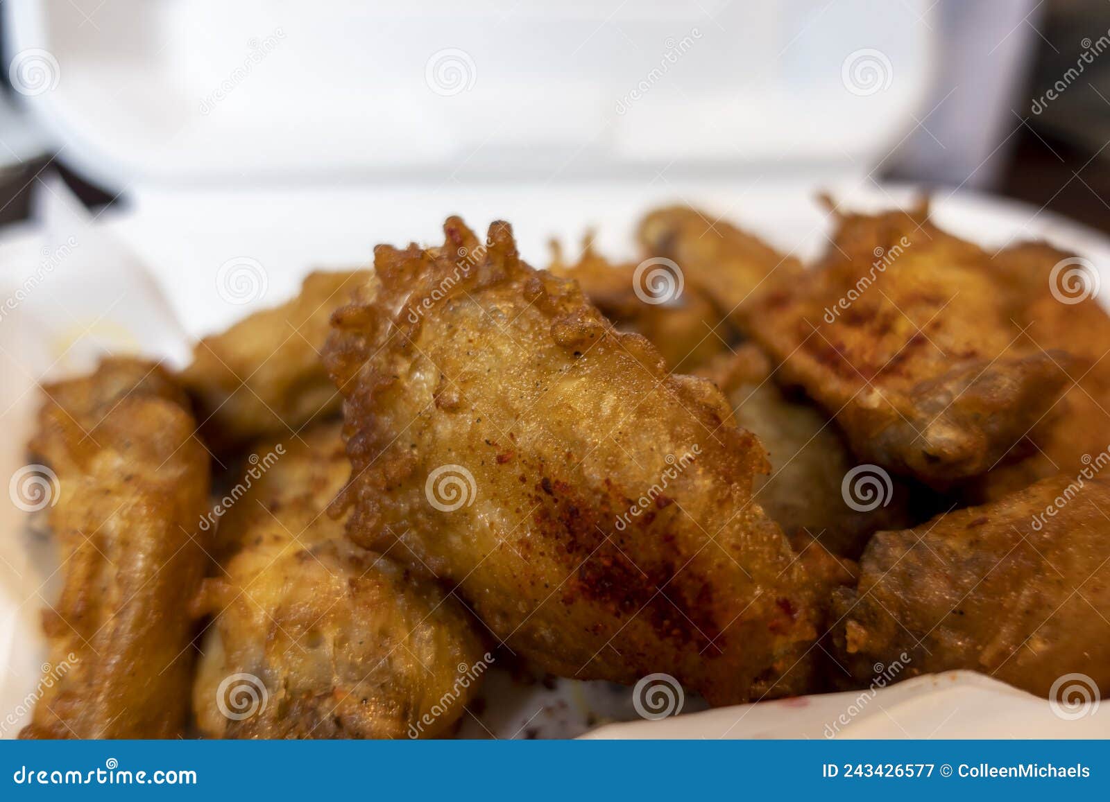 Close Up, Selective Focus on an Order of Crispy Chicken Wings in a ...