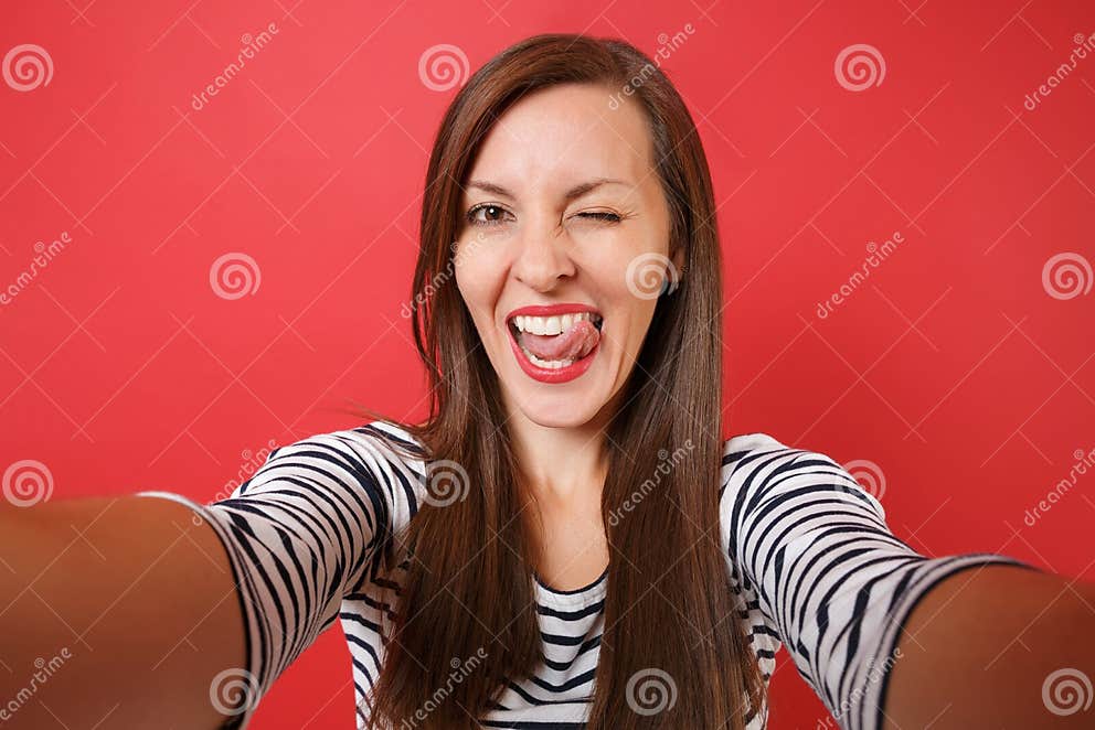 Close Up Selfie Shot Of Cheerful Young Woman In Casual Striped Clothes