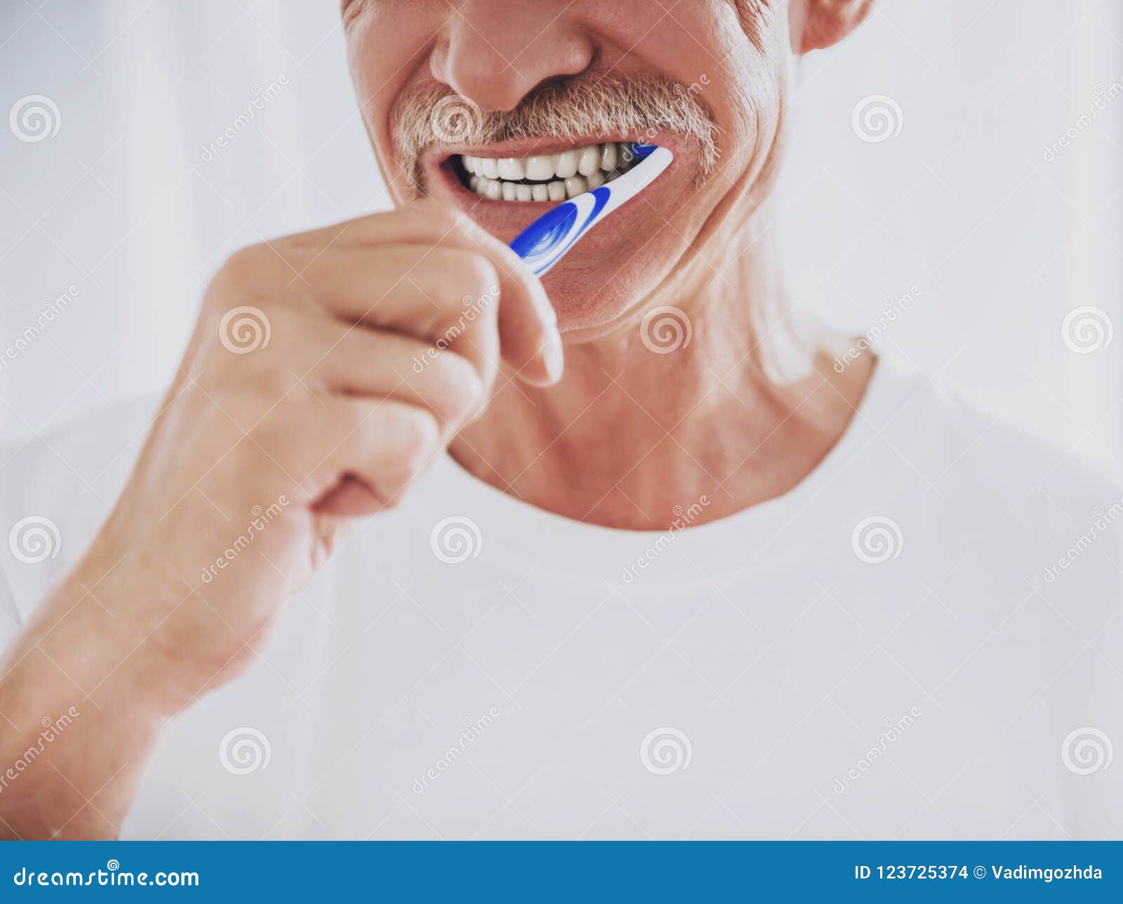 Close Up. Senior Man Brushing Teeth in Bathroom Stock Photo - Image of ... Close Up. Senior Man Brushing Teeth in Bathroom Stock Photo - Image of ...