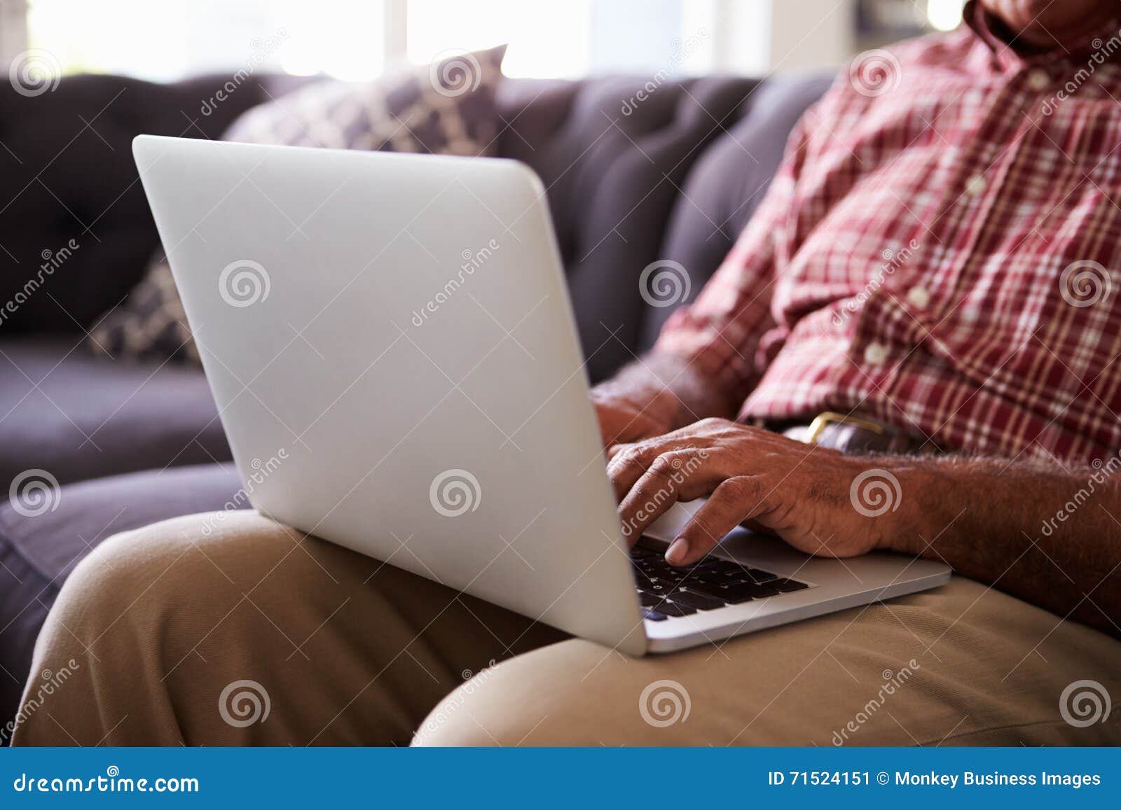 Close Up of Senior Man Sitting on Sofa Using Laptop Stock Image - Image ...