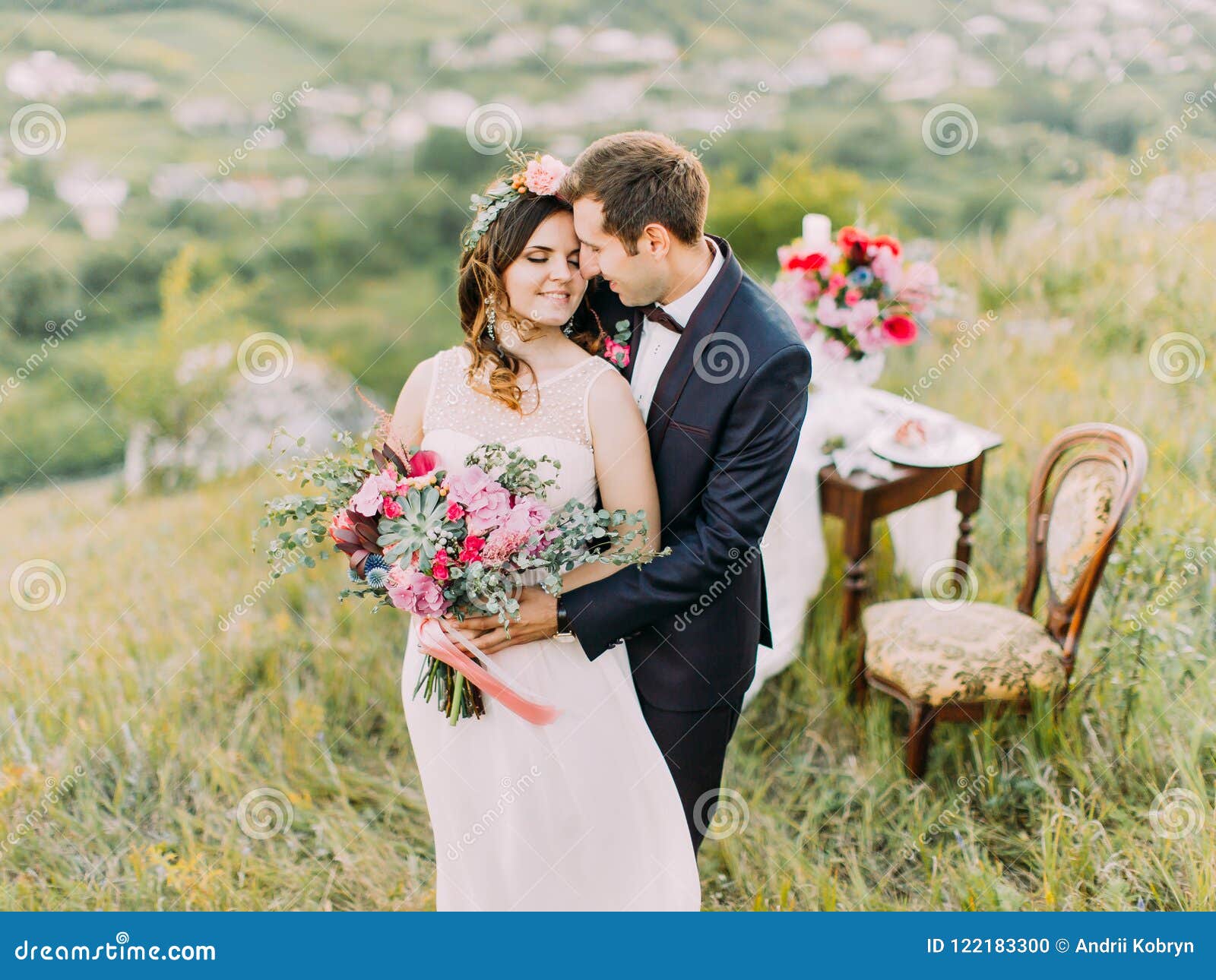 Close-up Sensitive Portrait of the Groom Hugging the Bride Back in the ...