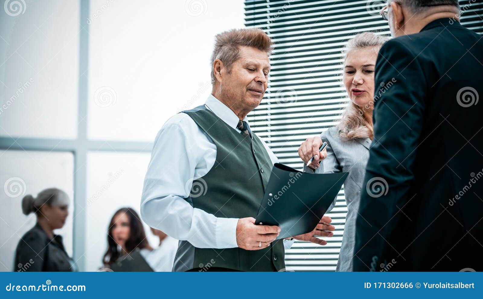 Close Up. Serious Employees Discuss Something Standing in the Office ...