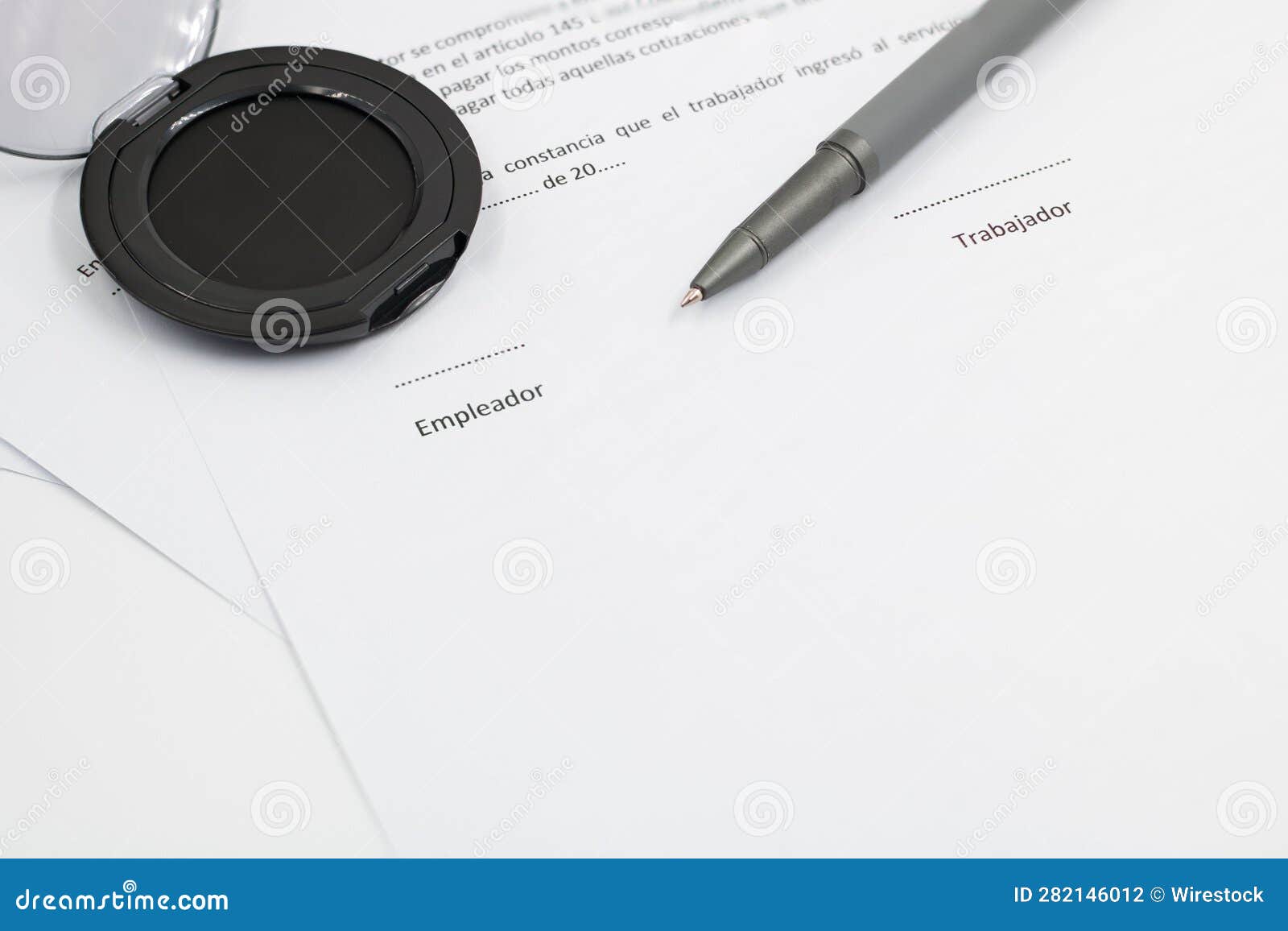 Close-up of a Set of Documents in Spanish with a Stamp and Pen on Top ...