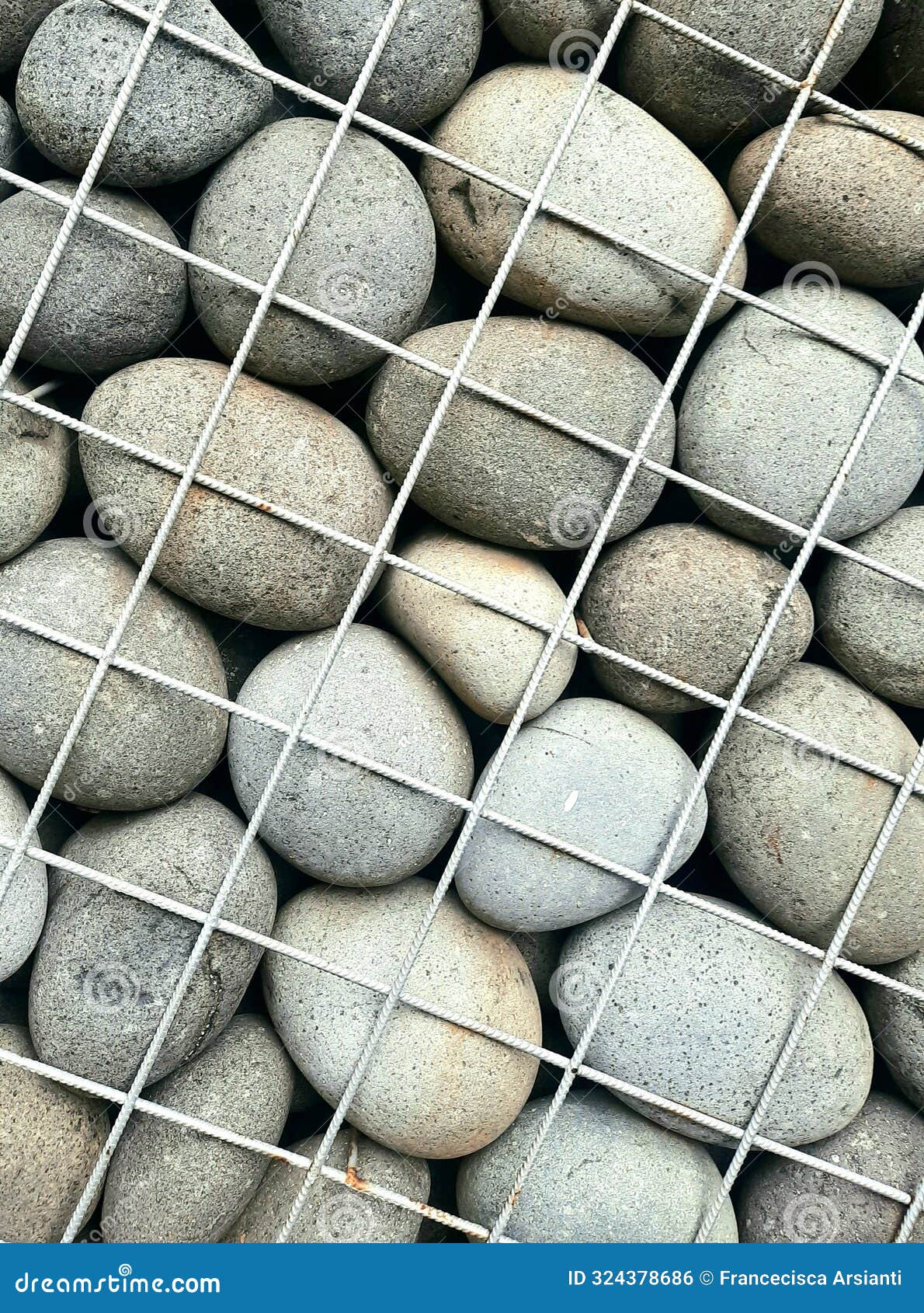 A Close-up of Several Smooth, Rounded Stones Arranged within a Grid ...