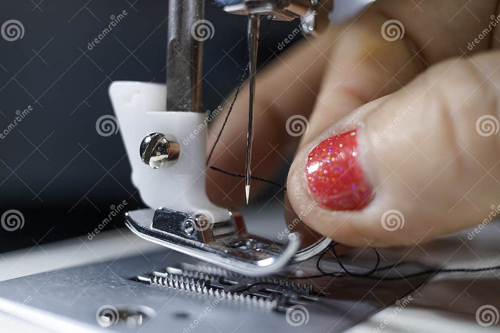 Close-Up of Sewing Machine Needle and Threading Process. Stock Photo ...