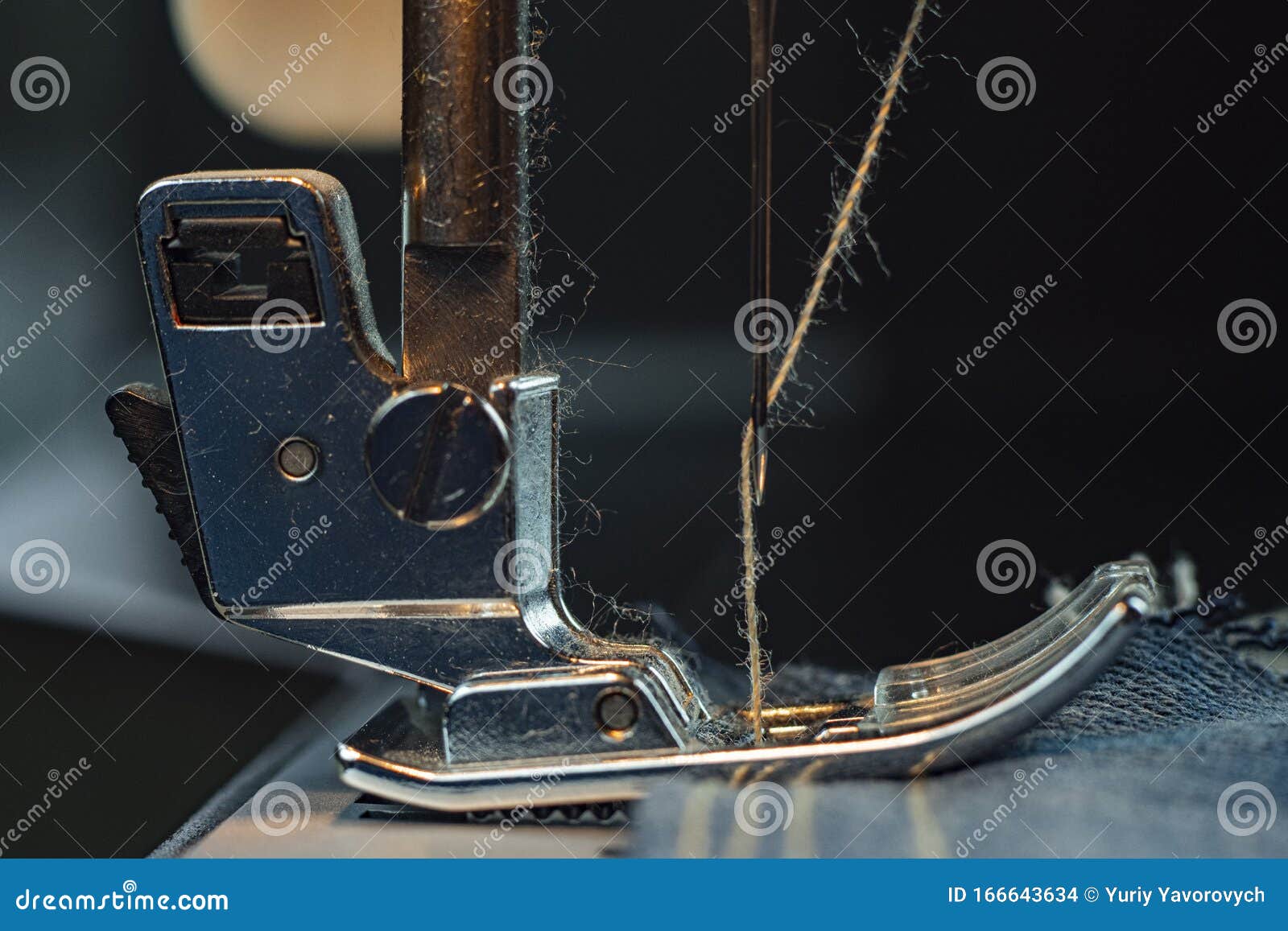 Close-up. a Sewing Machine Sews Denim. Clothes for Workers. Macro ...