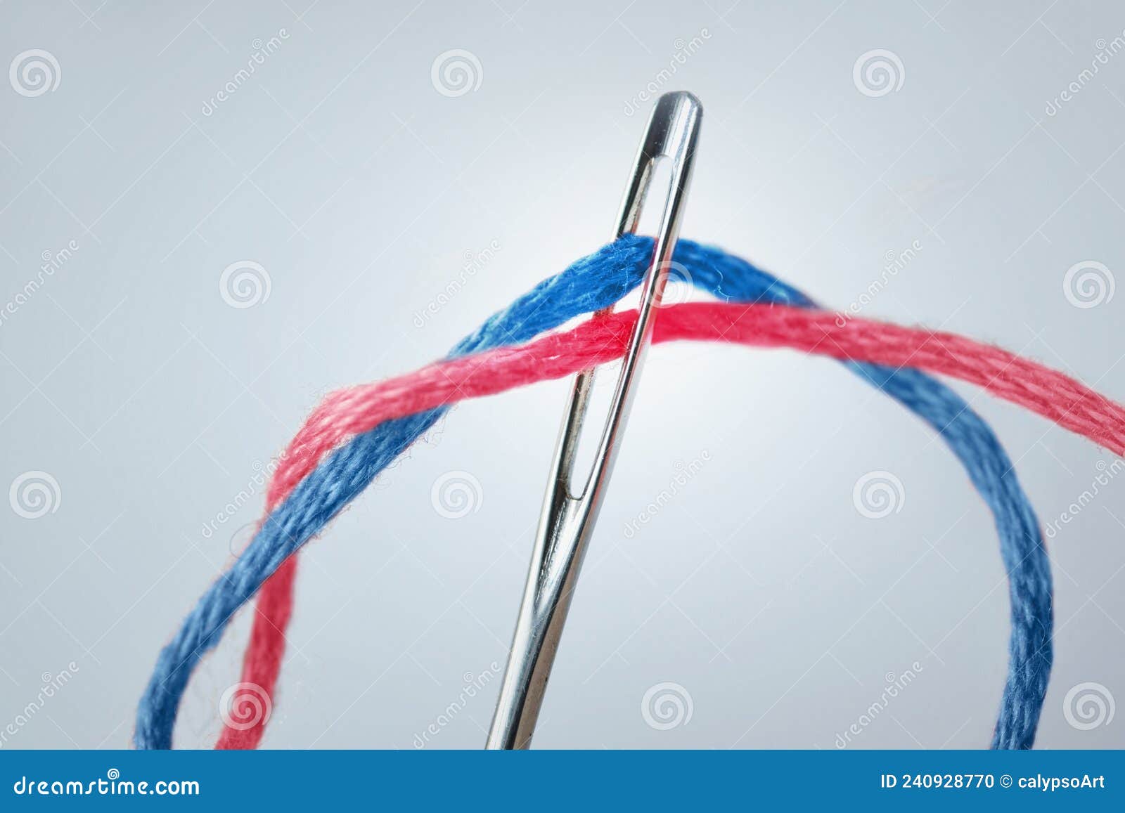 Close-up of Sewing Needle Eye with Pink and Blue Thread - Concept of ...