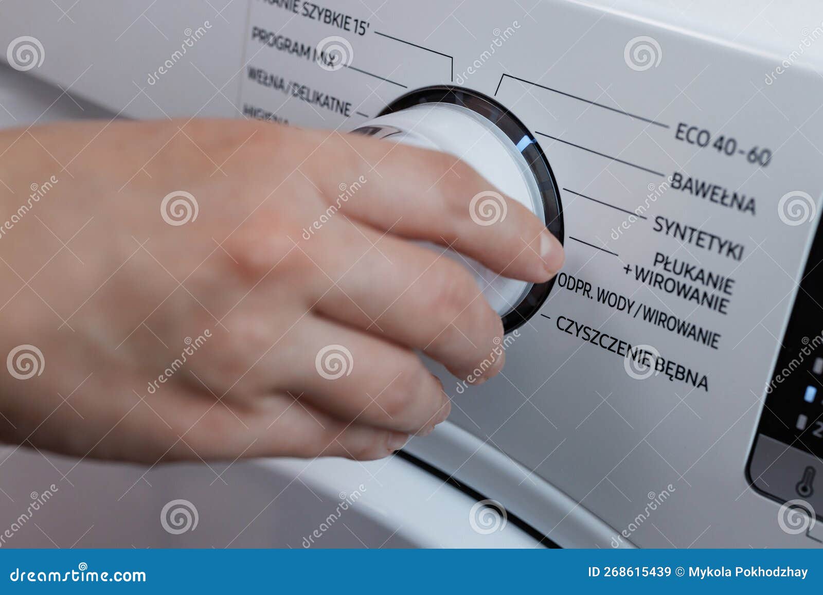 Close Up Shooting with a Hand Rotating the Front Panel Button ...