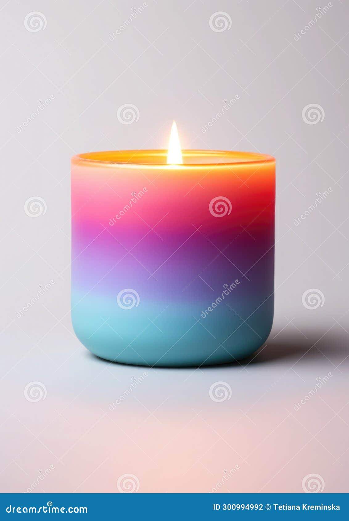 A Close-up Shot of a Candle in Rainbow Colors on a White Background ...