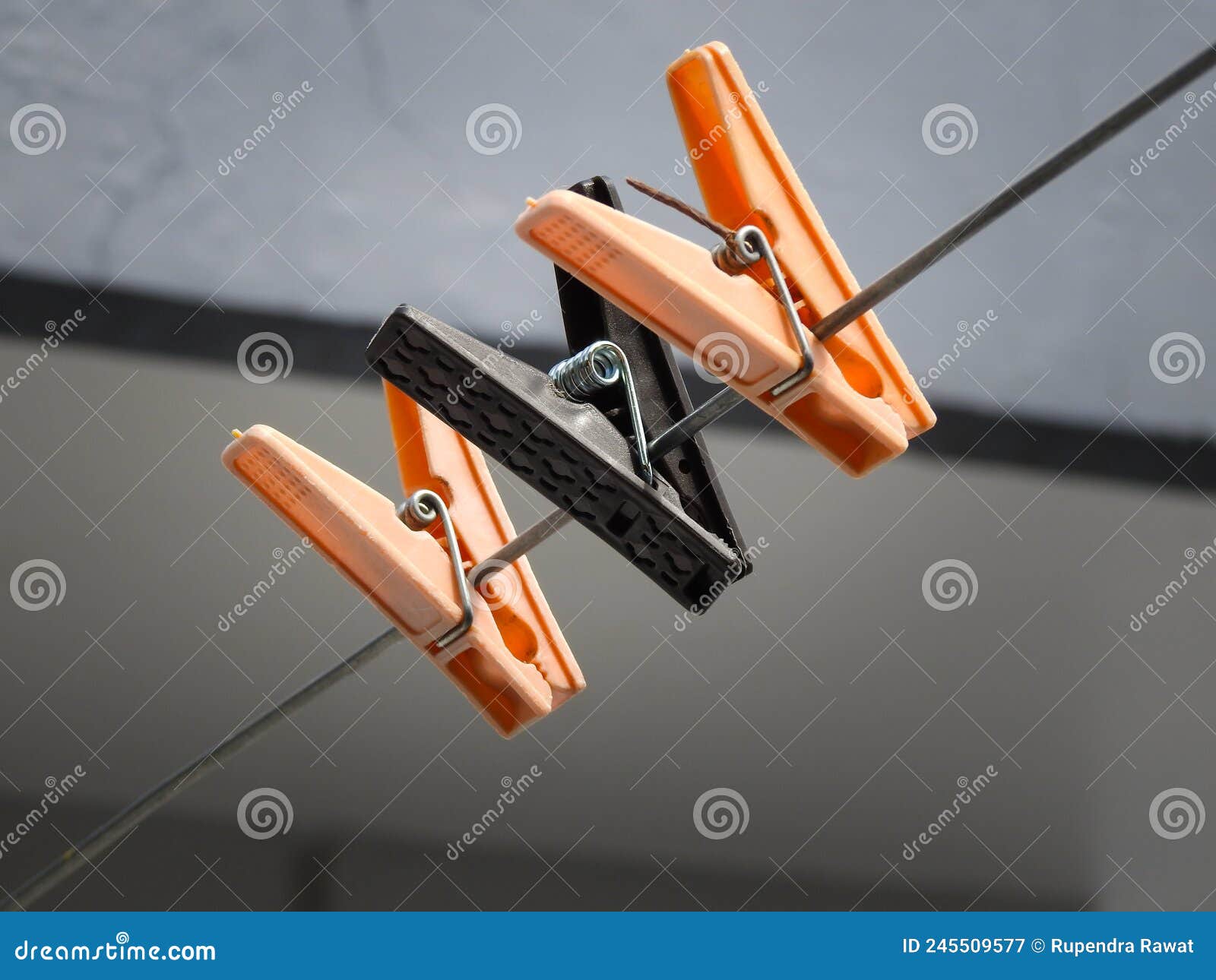 A Close Up Shot of Cloth Clipper on a Steel Wire Stock Image - Image of ...